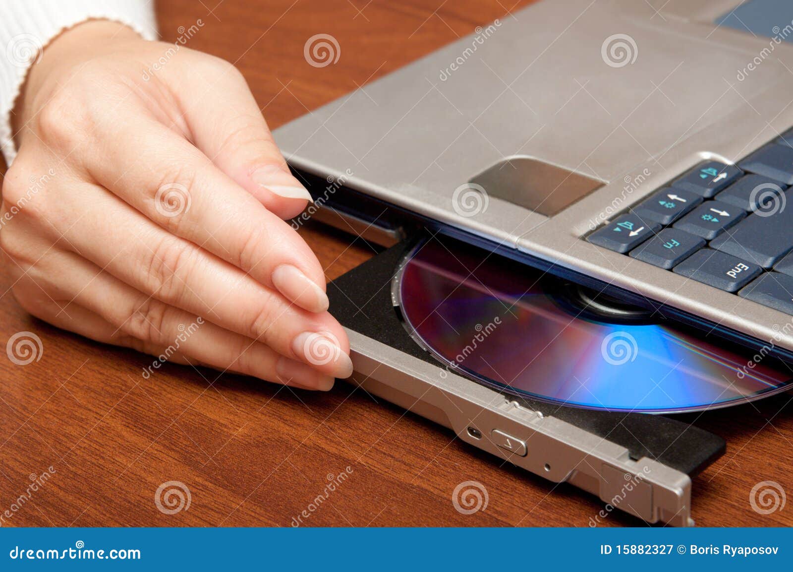 Compact disc on laptop stock image. Image of business - 15882327