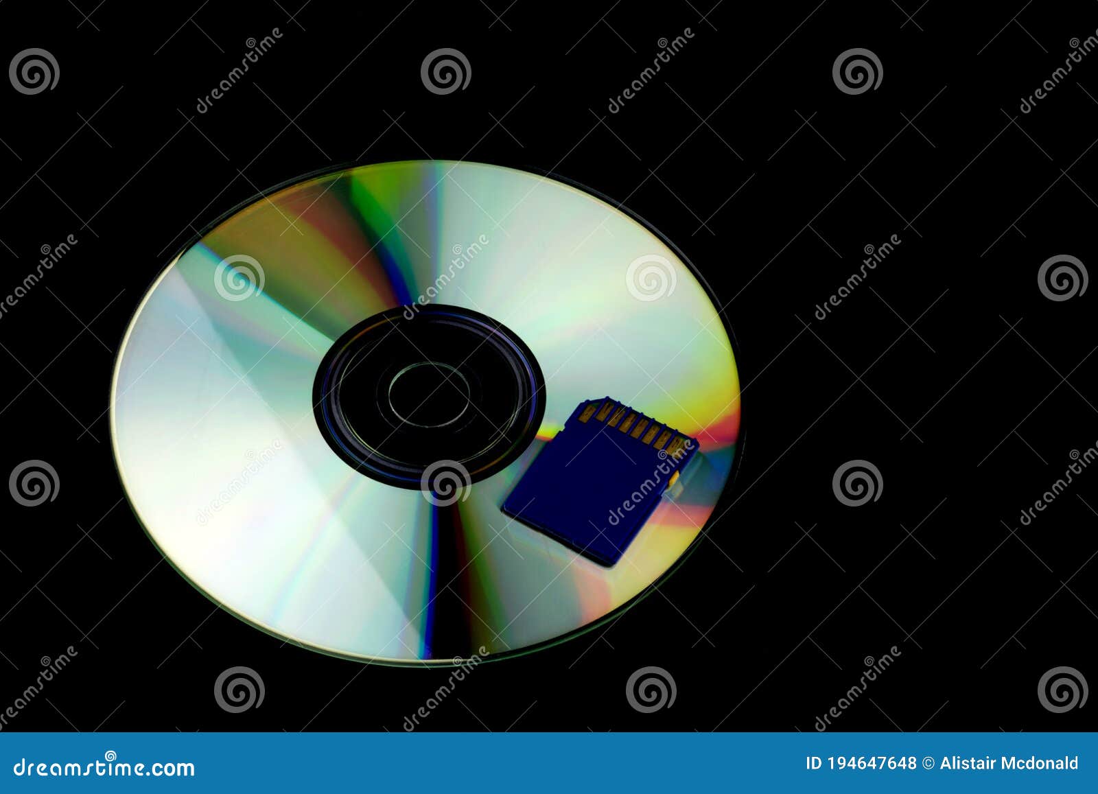 Compact Disc and Memory Card on a Black Background Stock Photo - Image ...