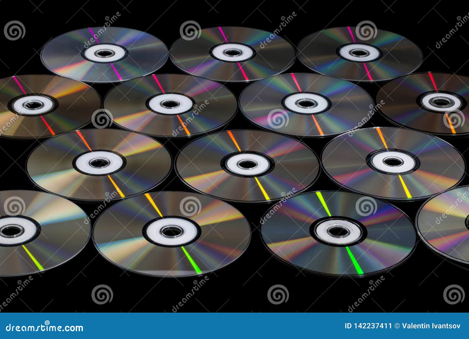 Compact Discs on a Black Background with Color Reflection Stock Image ...