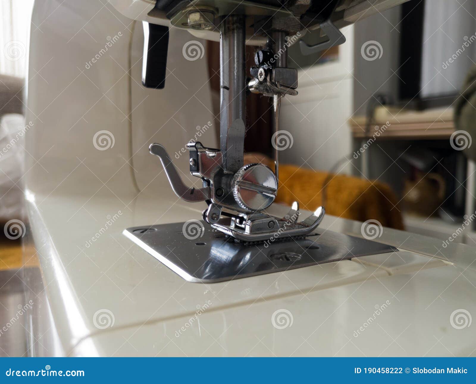 Compact Electric Sewing Machine on the Table in the Living Room Stock ...