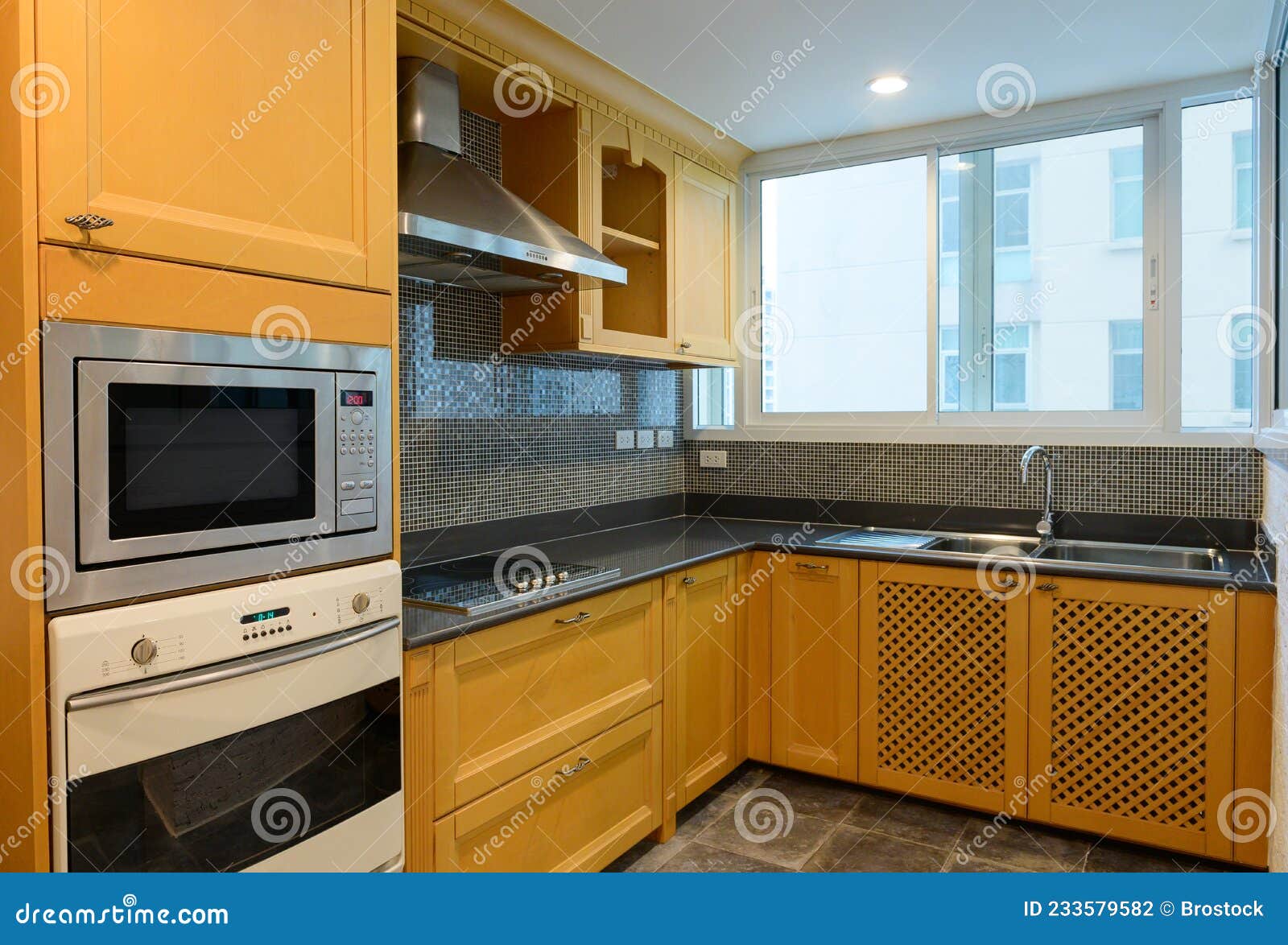 Compact Kitchen Interior with Wooden Cabinets Stock Photo - Image of ...