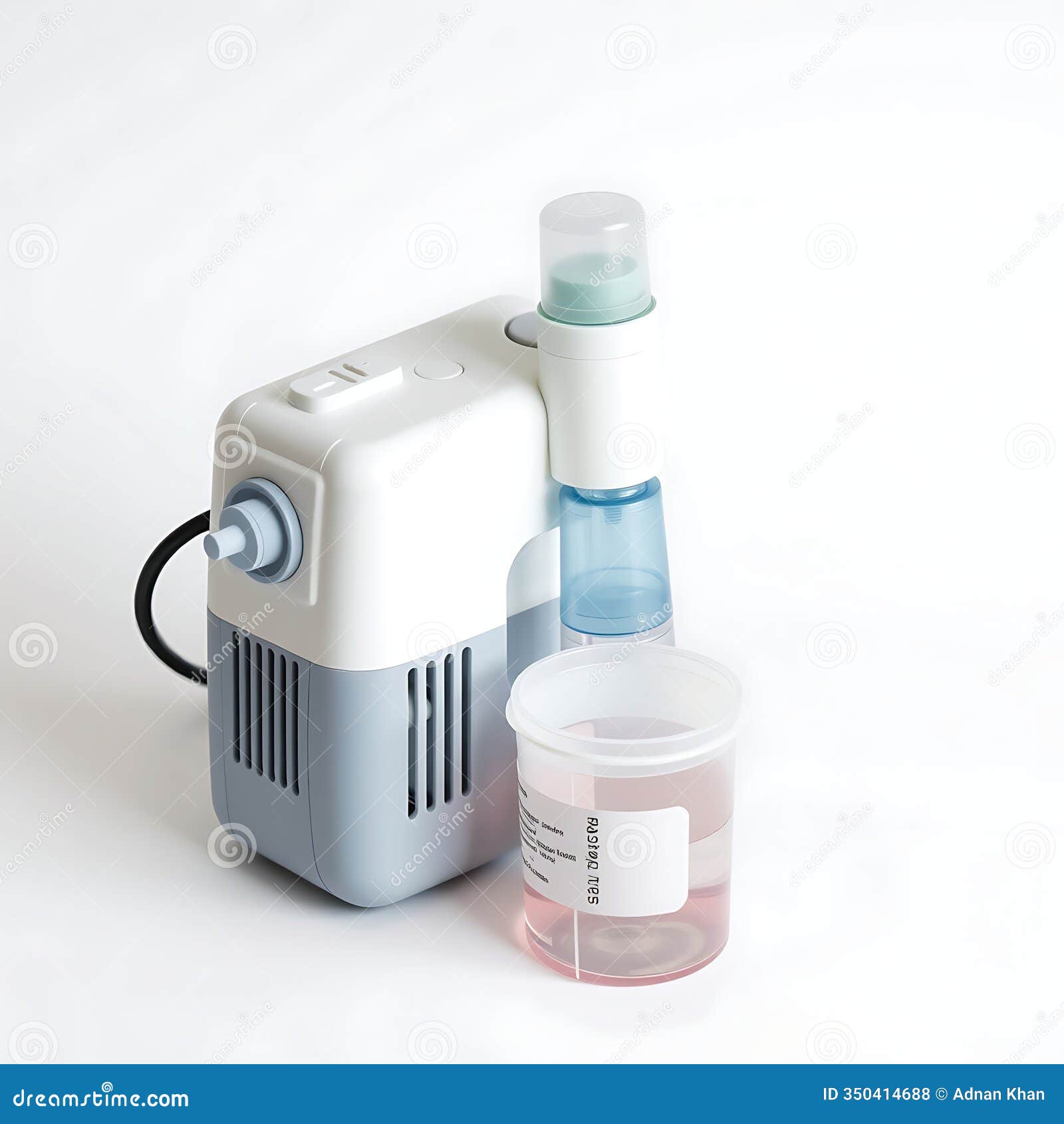 A Compact Nebulizer with a Small Compressor and Medicine Cup on White ...