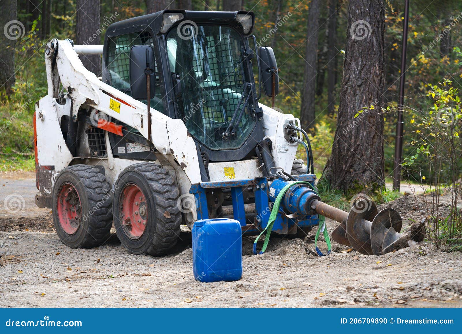 Compact Tractor with Drilling Rig in the Forest. Stock Photo - Image of ...