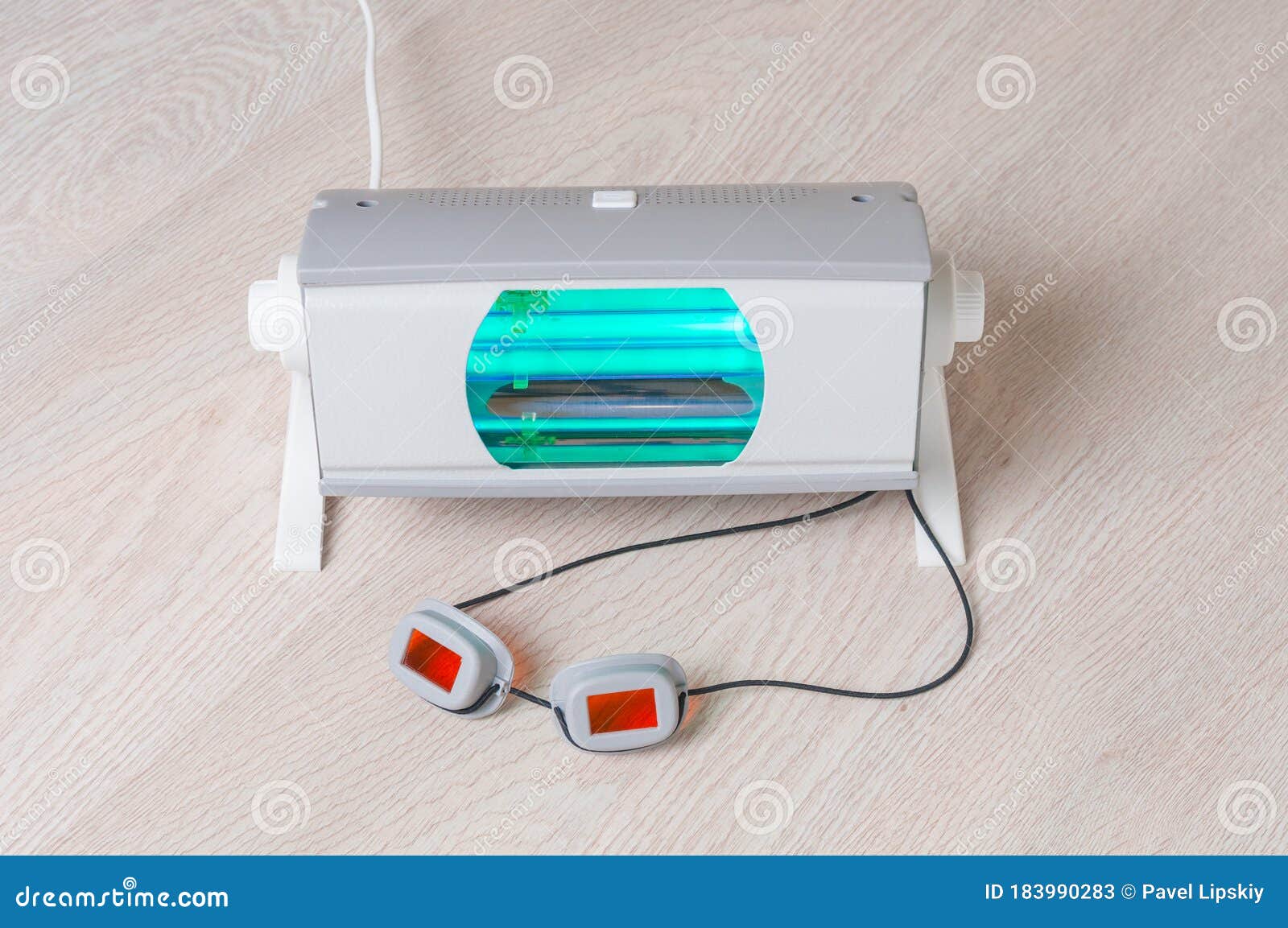 Compact Ultraviolet Irradiator and Protect Eyeglasses on Wooden ...