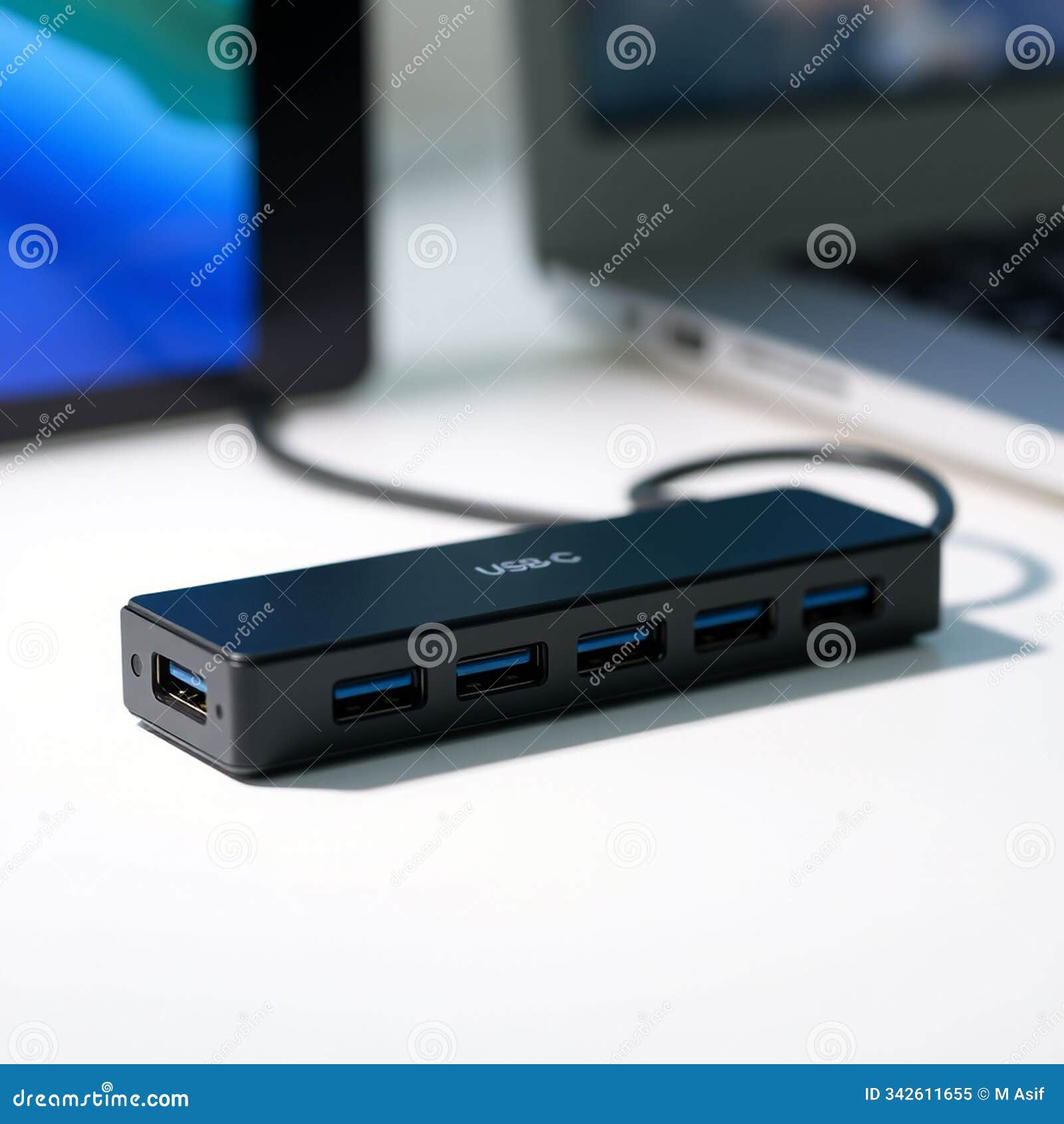 A Compact USB-C Hub with Multiple Ports, Featuring a Sleek Stock ...