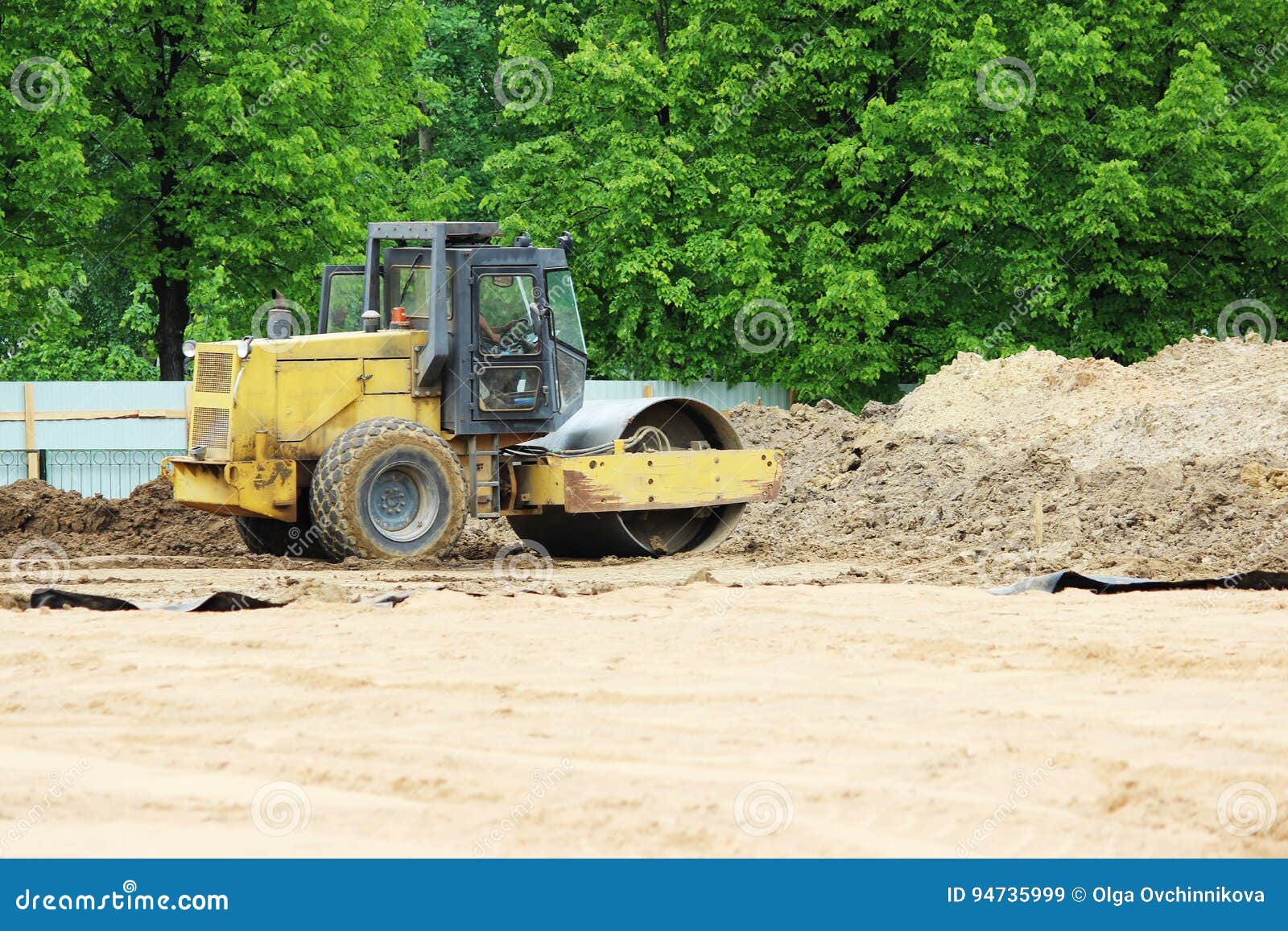Compactor is Compacting the Surface of the Earth. Construction of the ...