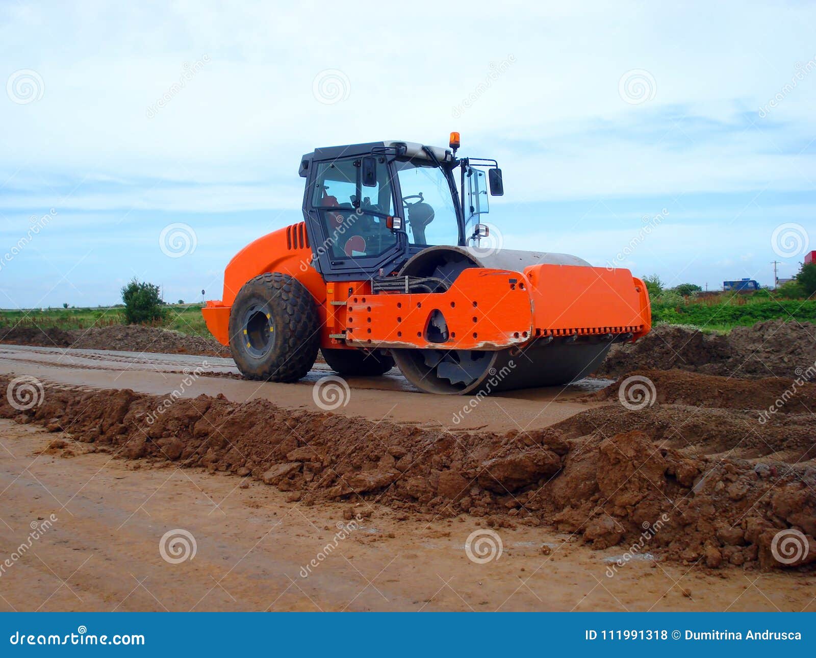 Orange compactor machinery stock photo. Image of granular - 111991318