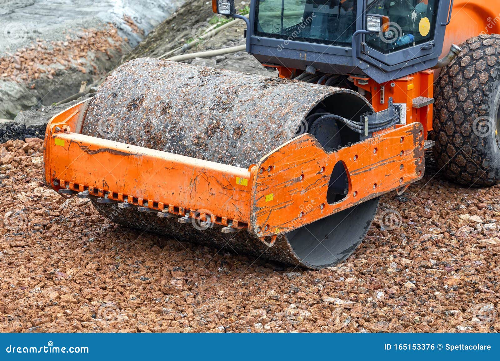Compactor with Vibratory Padfoot Drum Working Stock Photo - Image of ...