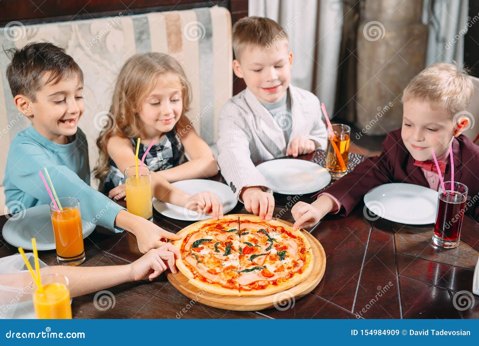 Company of Children Eat Pizza in the Restaurant Stock Image - Image of ...