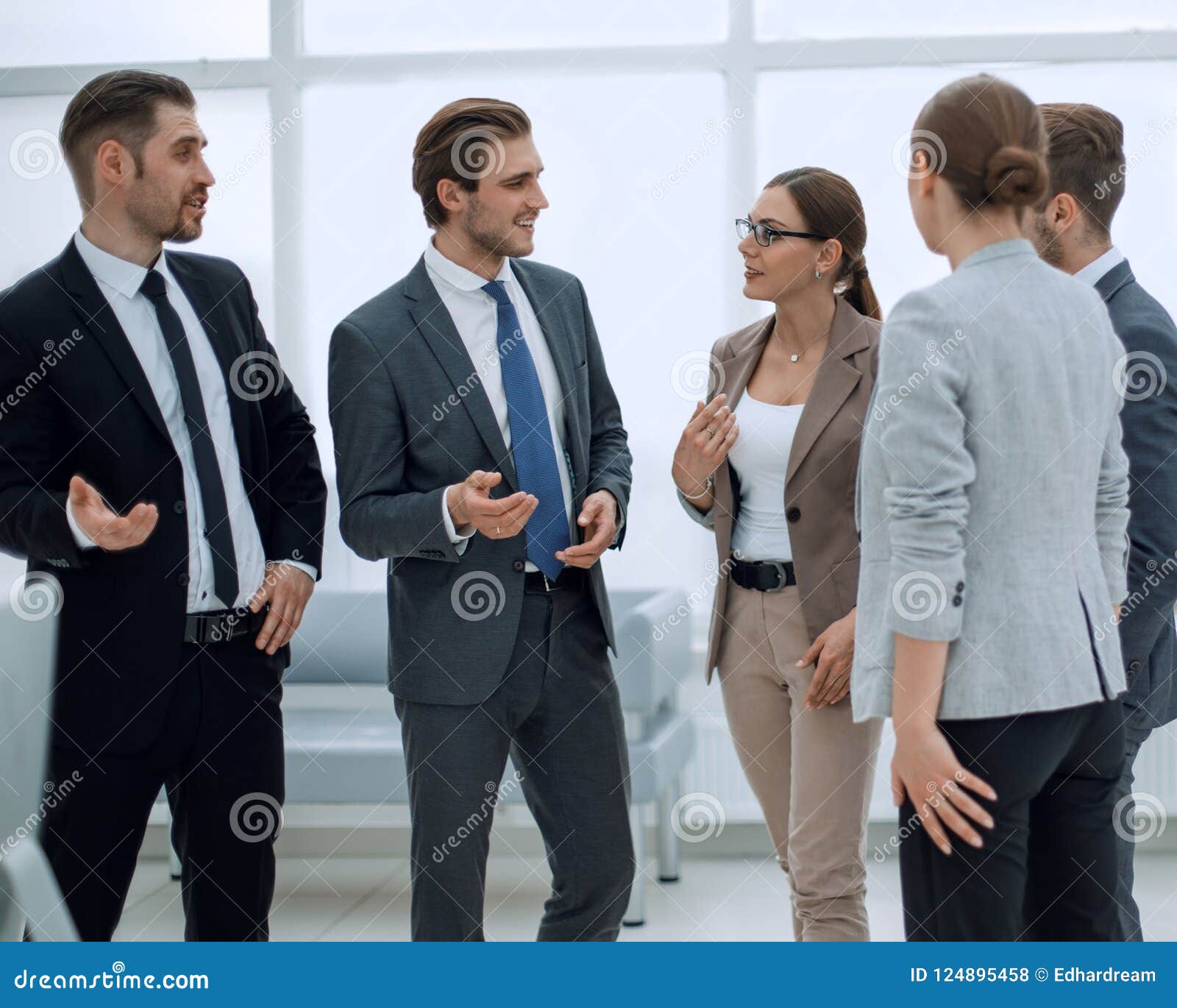 Company Employees Discussing Standing in the Office Stock Photo - Image ...