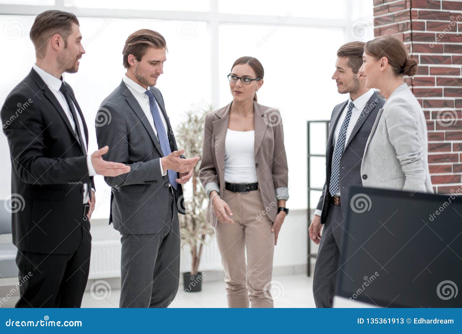 Company Employees Discussing Standing in the Office Stock Image - Image ...