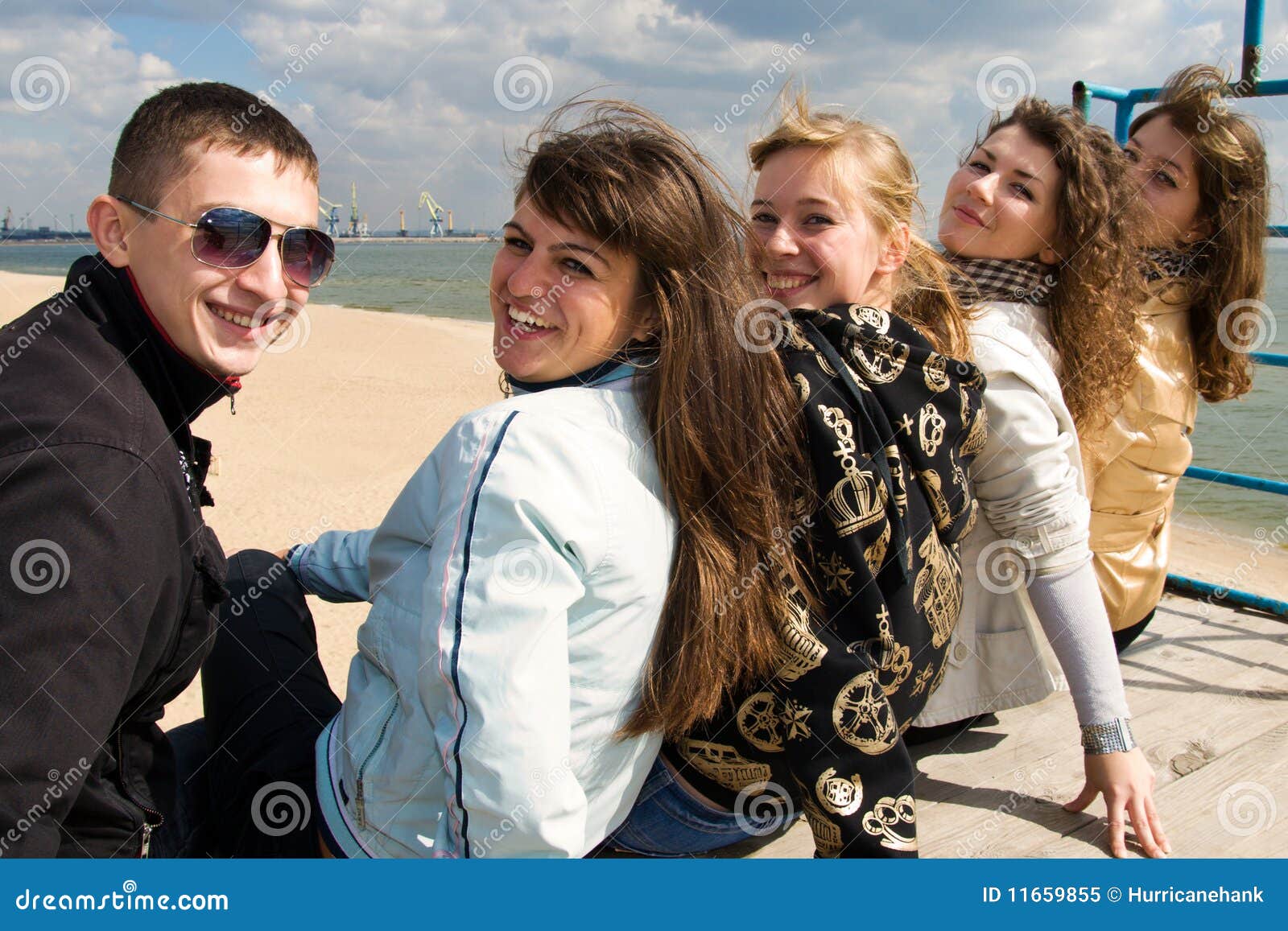 Company of Five Young People Sitting Together Stock Image - Image of ...