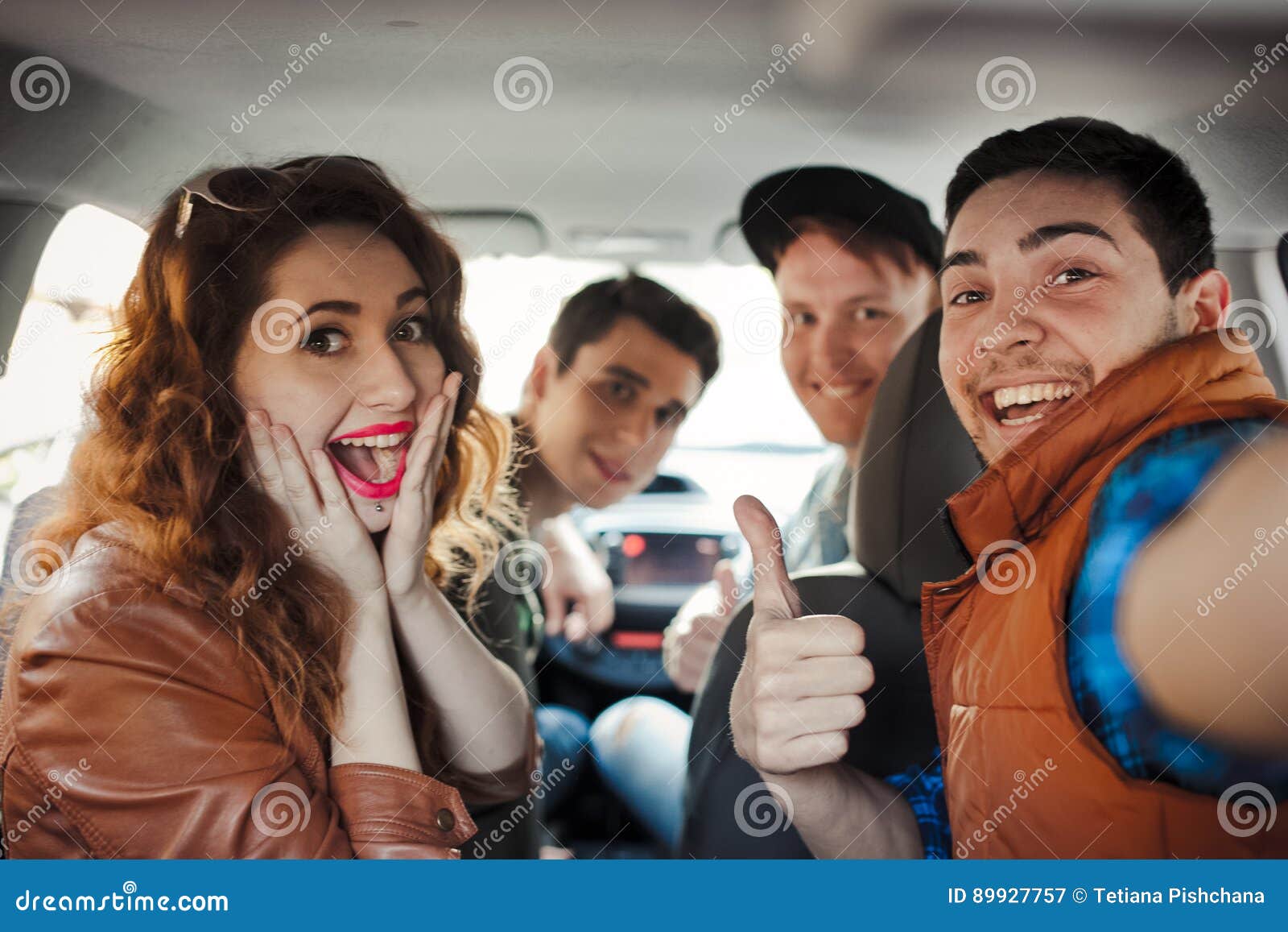 A Company of Four Friends Makes Selfie Inside the Car Stock Image ...