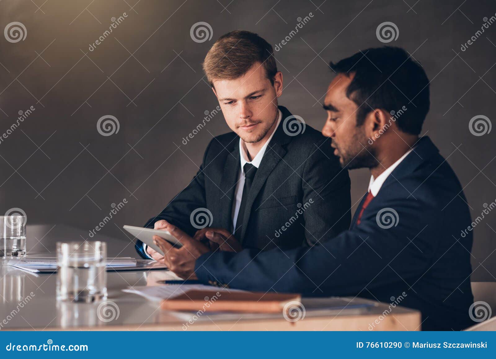 Comparing Digital Notes in the Boardroom Stock Photo - Image of ...