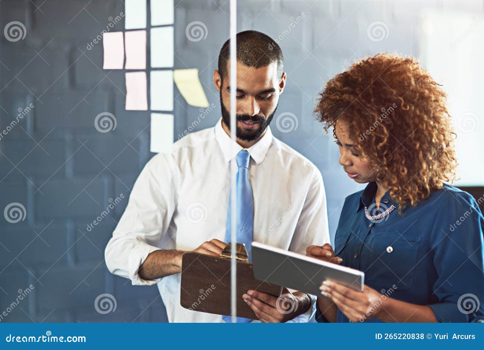 Comparing Ideas with a Colleague. Two Young Professionals Brainstorming ...