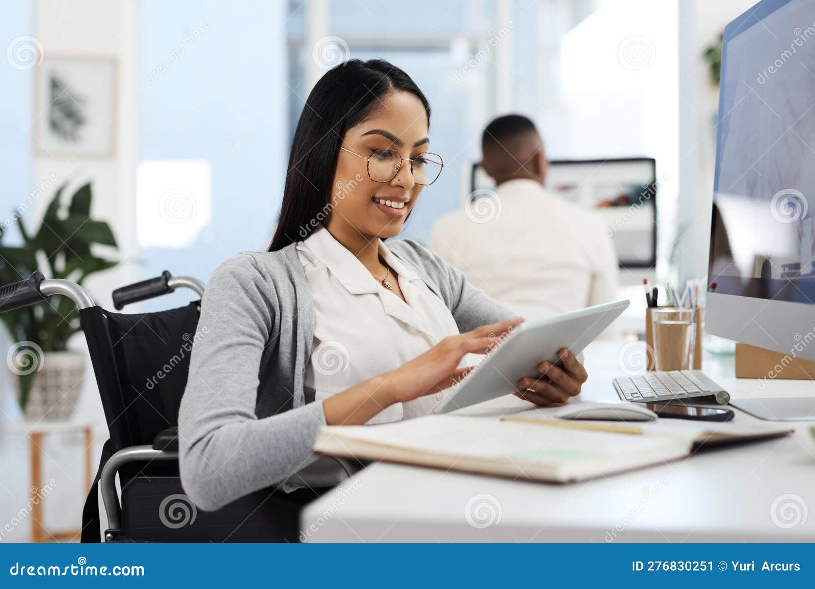 Comparing Notes. an Attractive Young Businesswoman Working on a Tablet ...