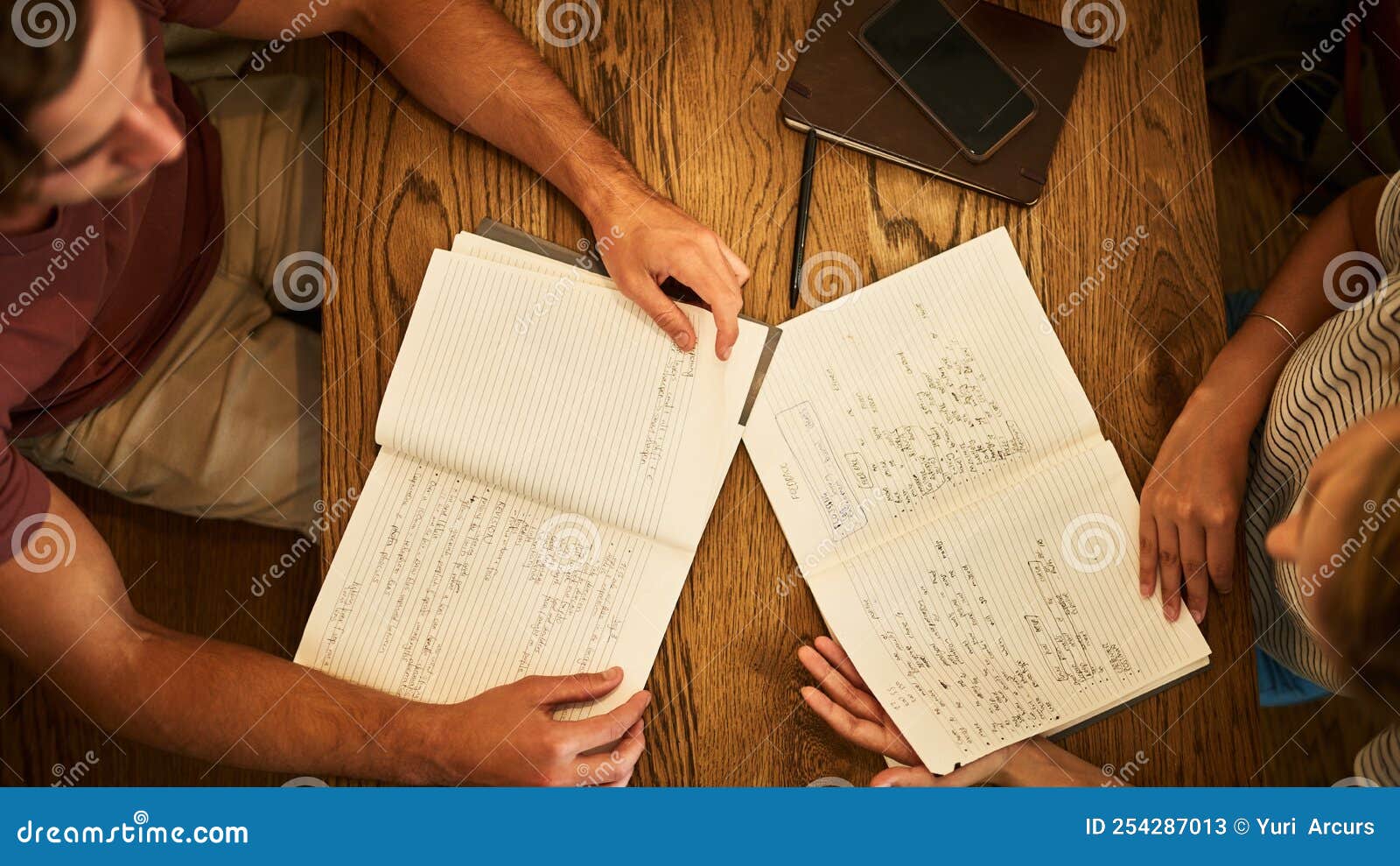 Comparing Notes at the Cafe. High Angle Shot of Two Unidentifiable ...