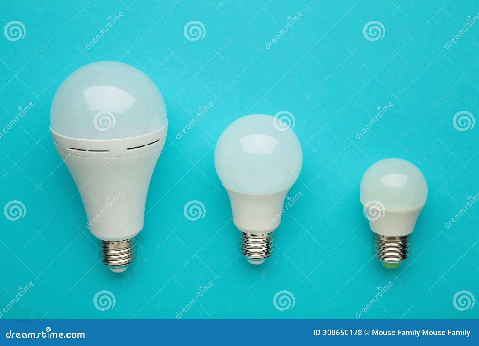 Comparison of Different Light Bulbs on Blue Background Stock Photo ...