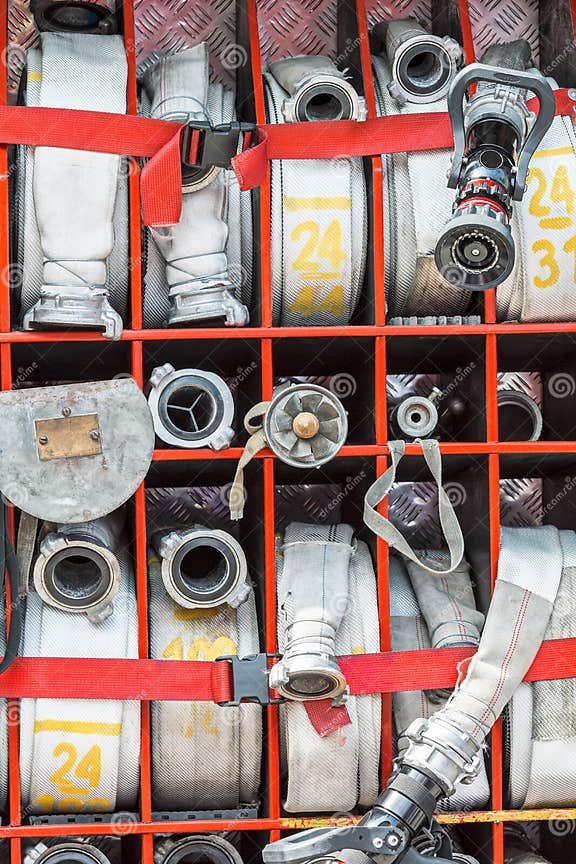 Compartment of Rolled Up Fire Hoses on Fire Truck Stock Photo - Image ...