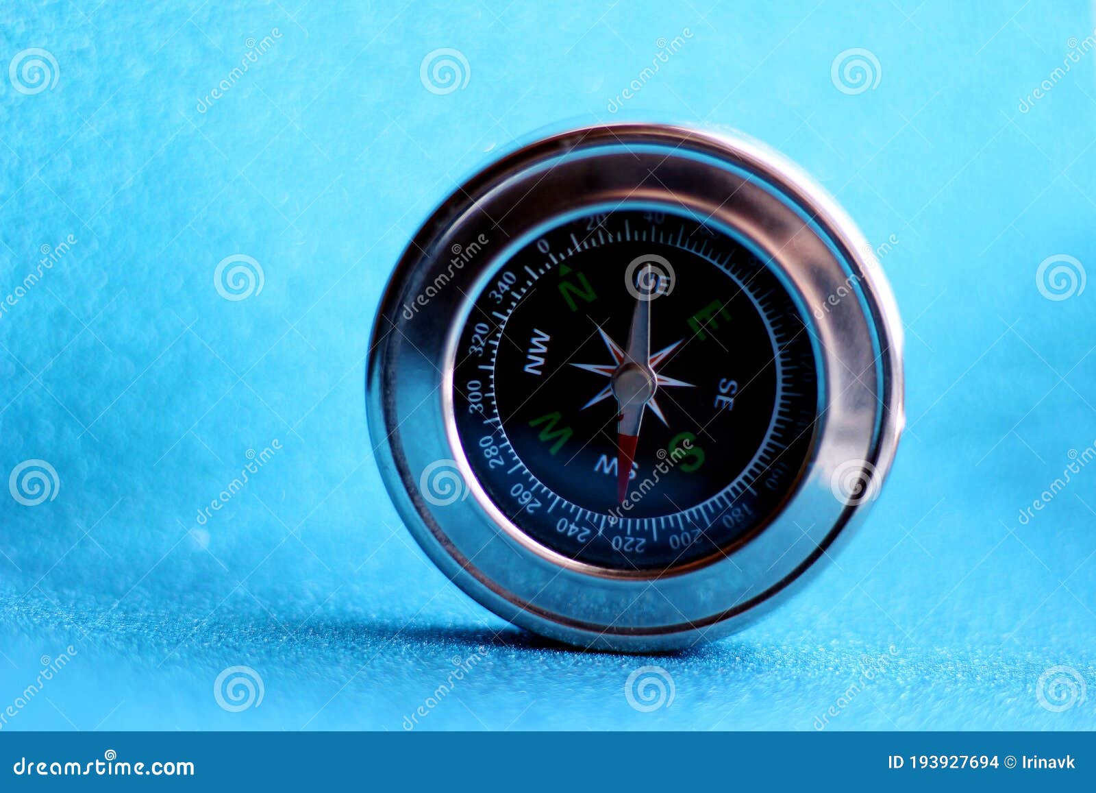 Compass on an Abstract Blue Background with Bokeh. Photo Stock Photo ...
