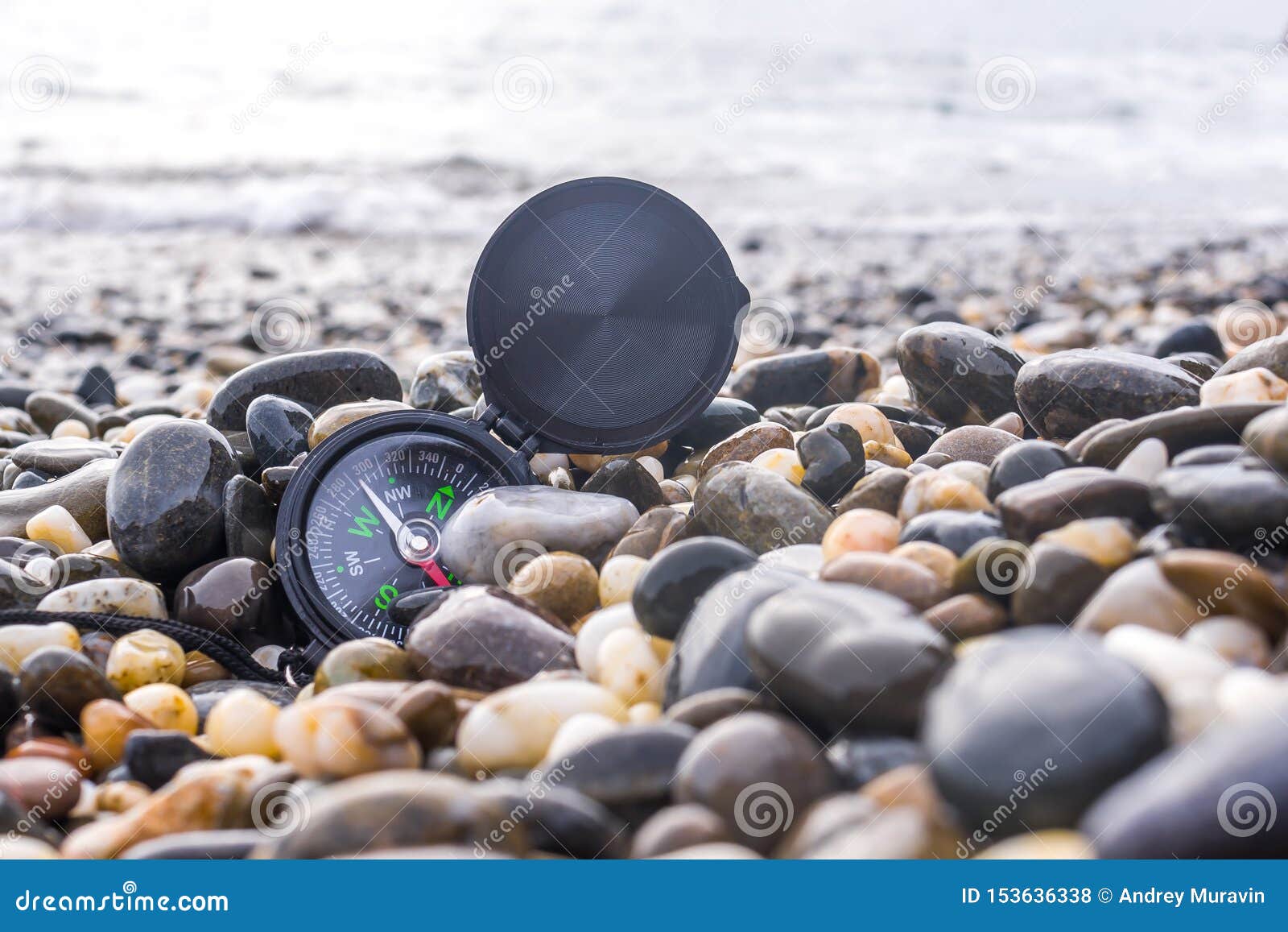 Compass on the beach stock photo. Image of travel, beach - 153636338