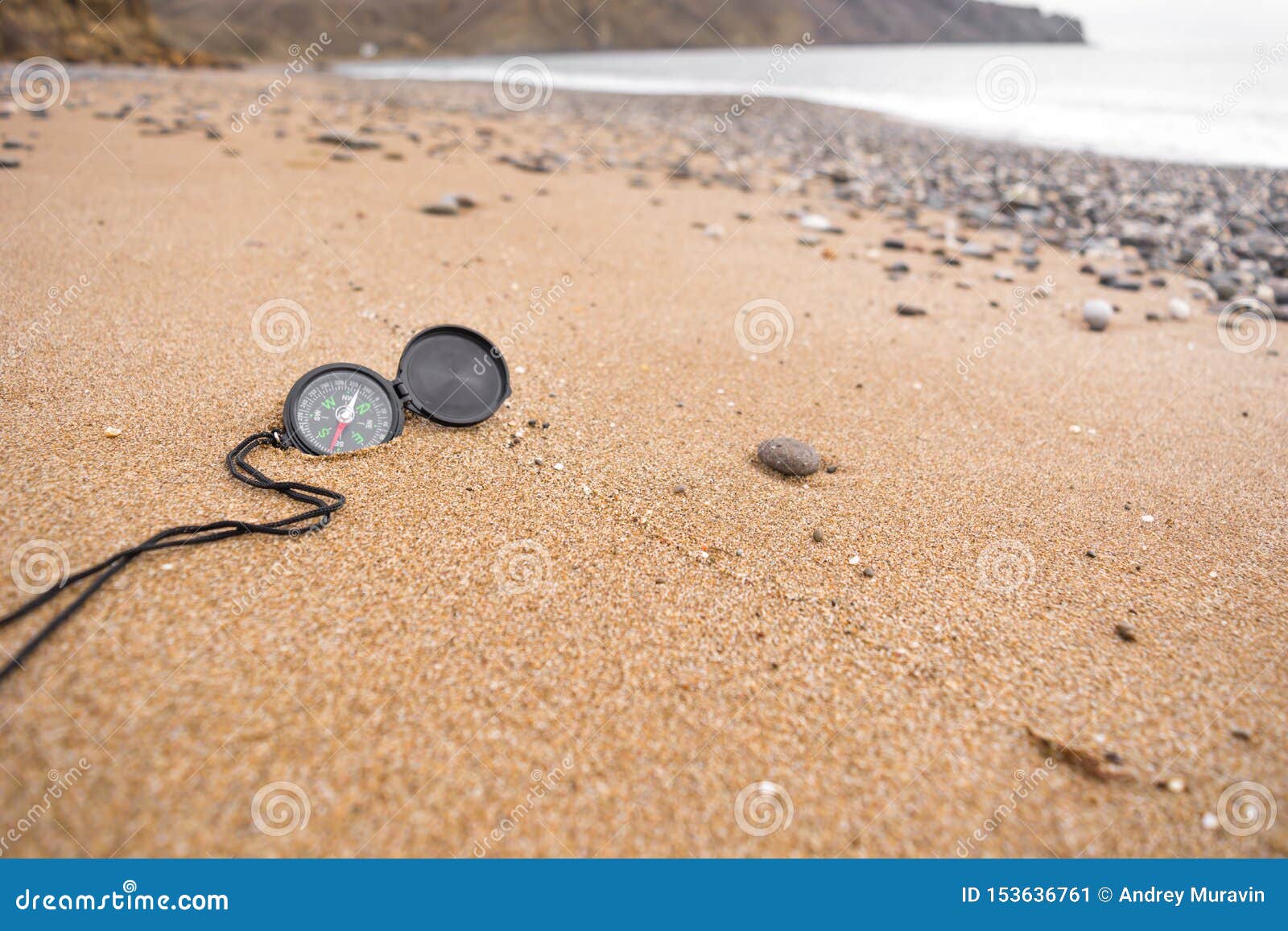 Compass on the beach stock image. Image of discovery - 153636761