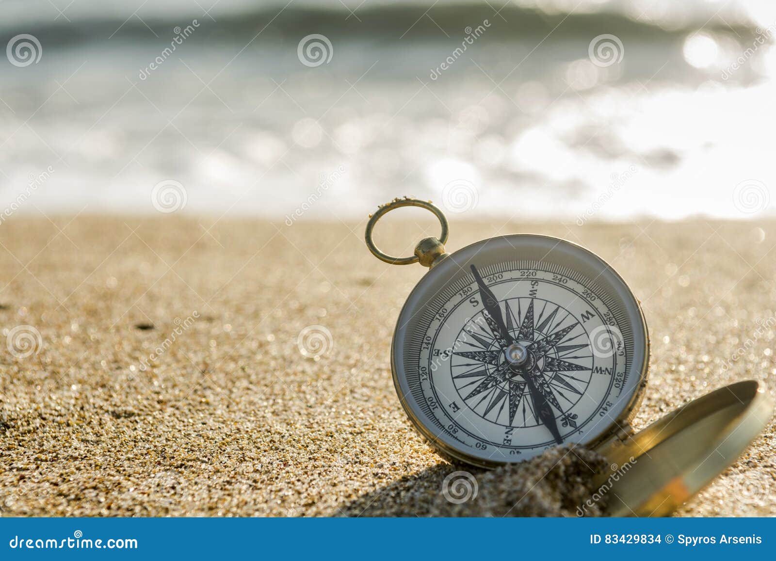 Compass on the beach stock photo. Image of discovery - 83429834