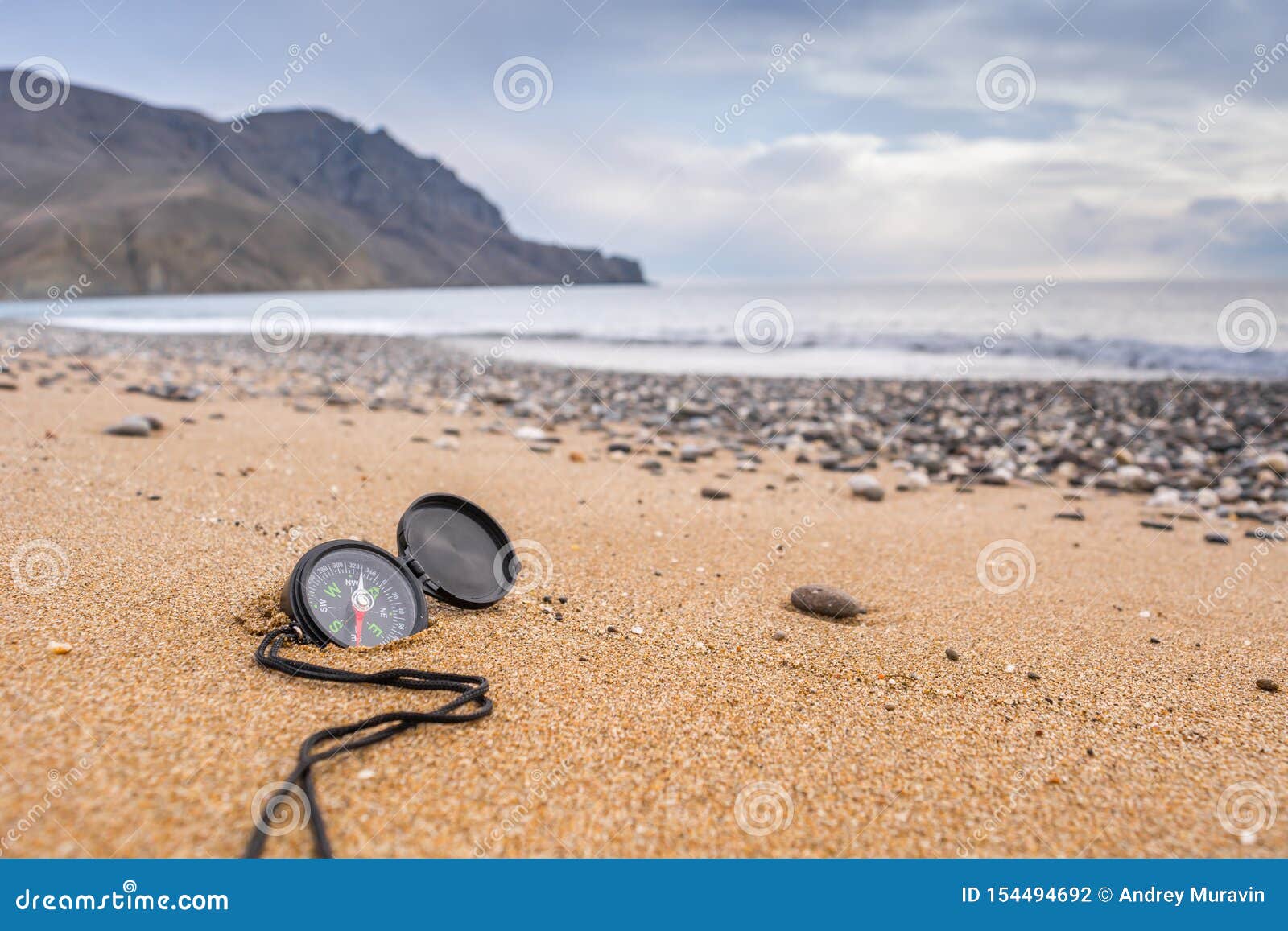 Compass on the beach stock photo. Image of discovery - 154494692