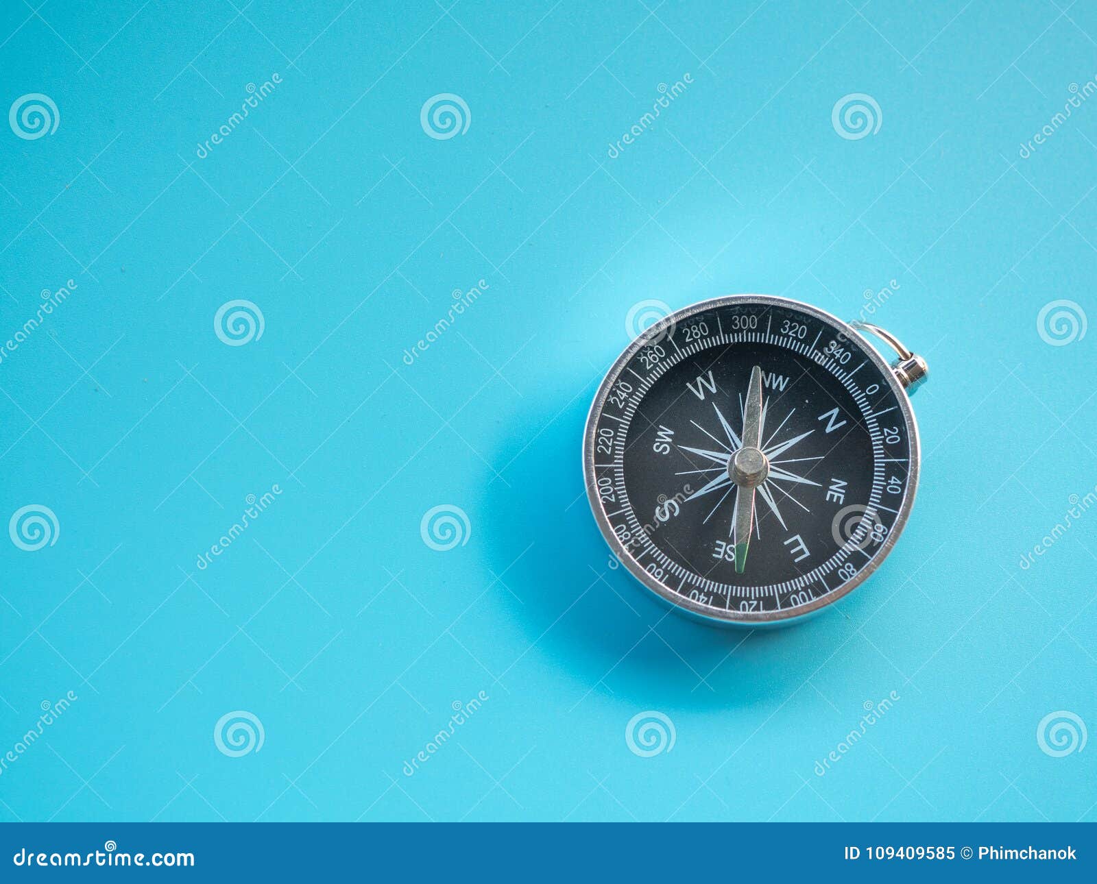 Compass on blue background stock image. Image of compass - 109409585