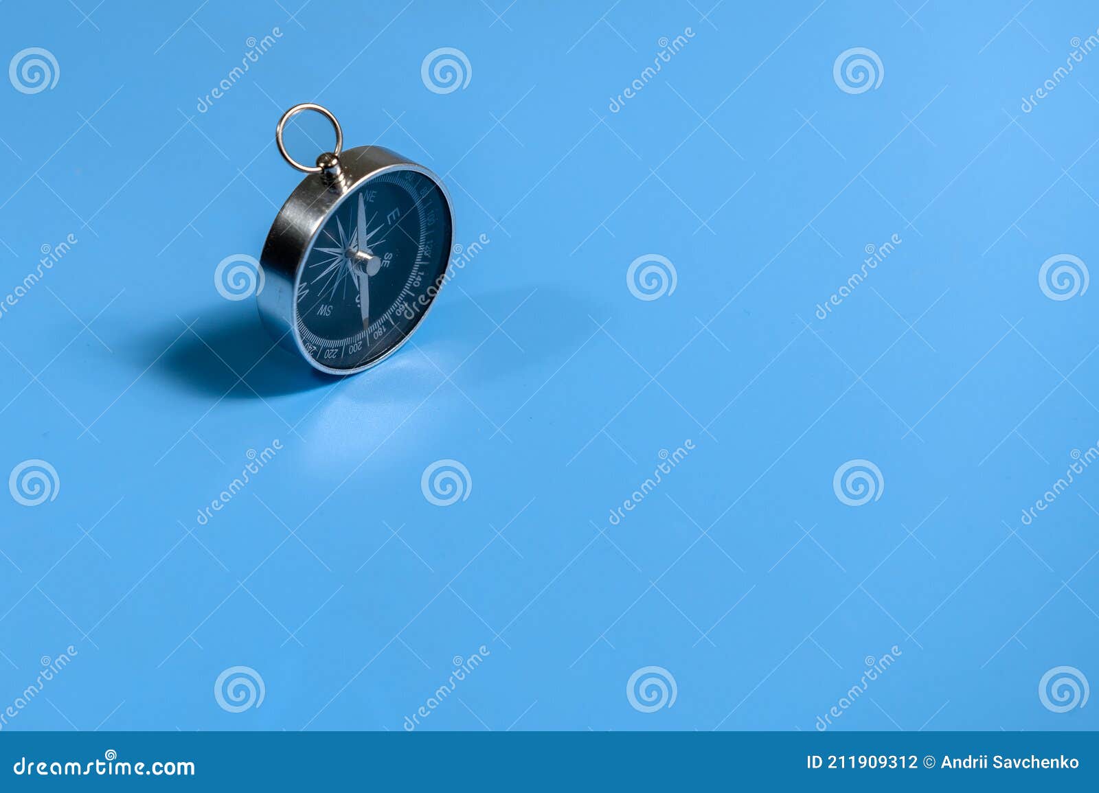 Compass on Blue Background with Copy Space. Direction Concept Stock ...