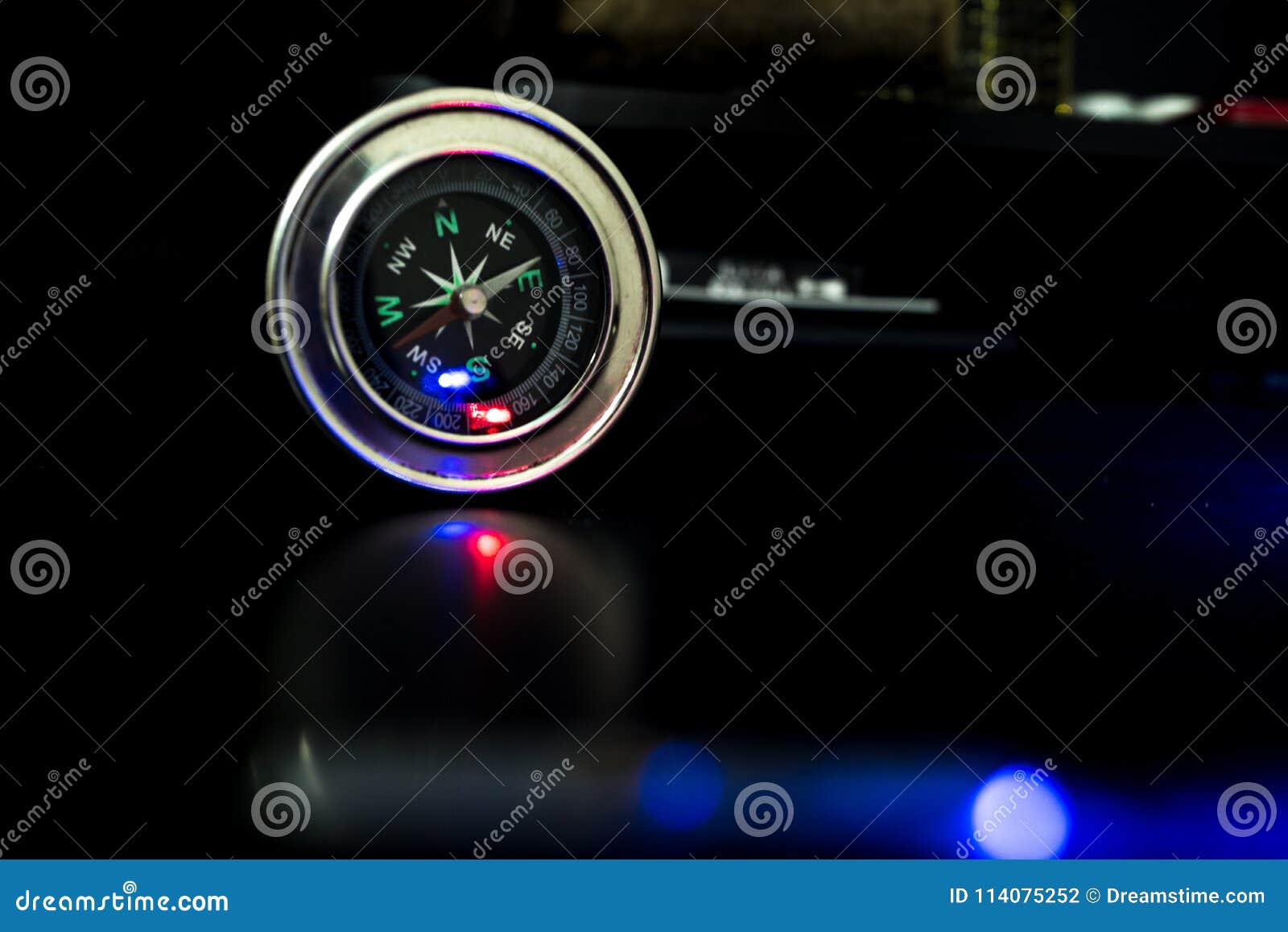 Compass with Blue Light Falling on it. Stock Photo - Image of equipment ...
