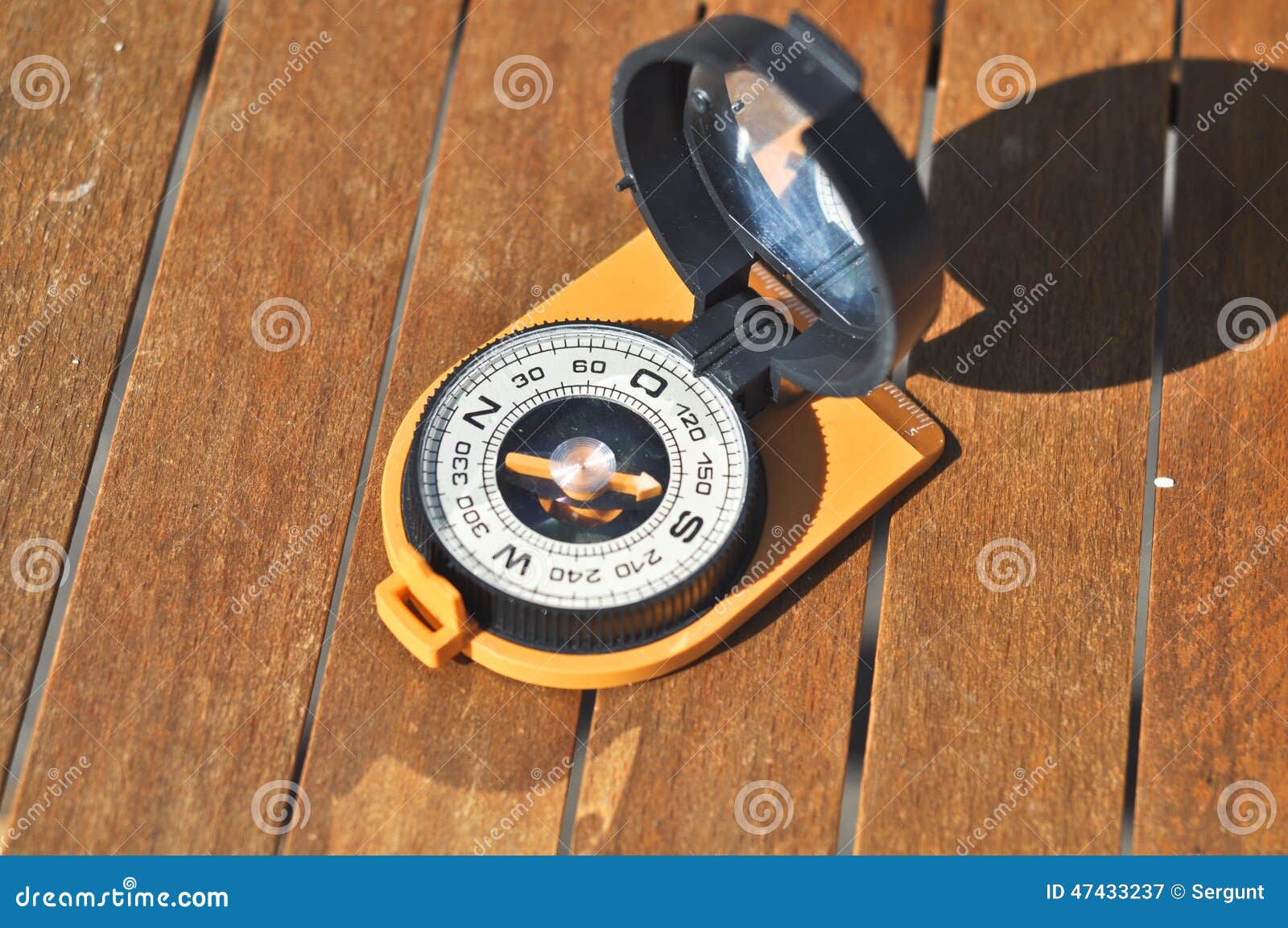 Compass on the boards. stock image. Image of hardwood - 47433237