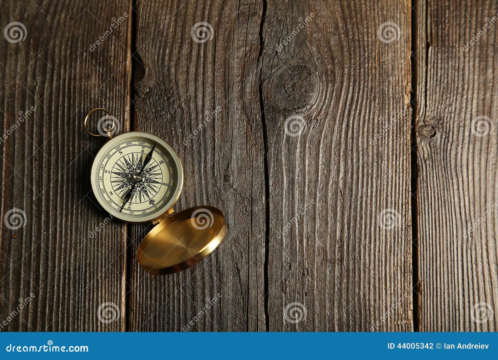 Compass on Brown Wooden Background Stock Photo - Image of macro ...