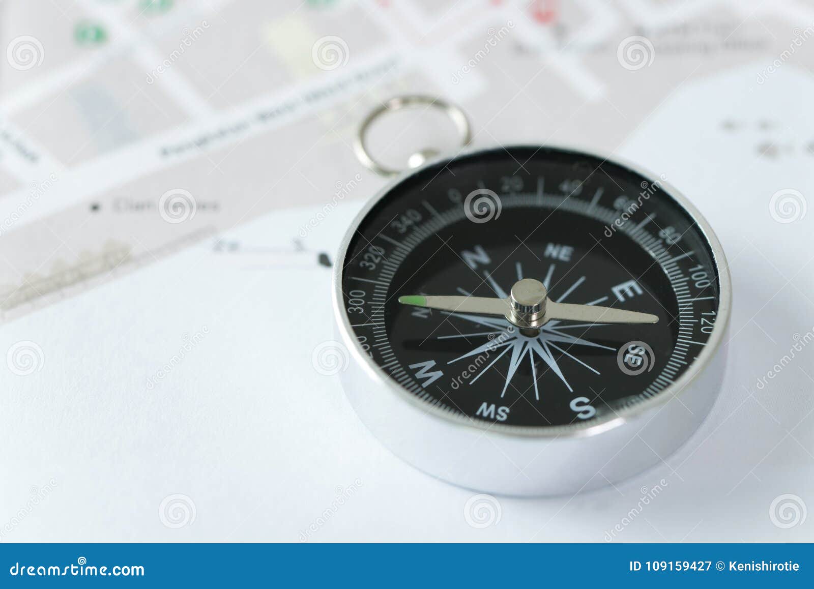 Compass on a city map stock image. Image of geographical - 109159427
