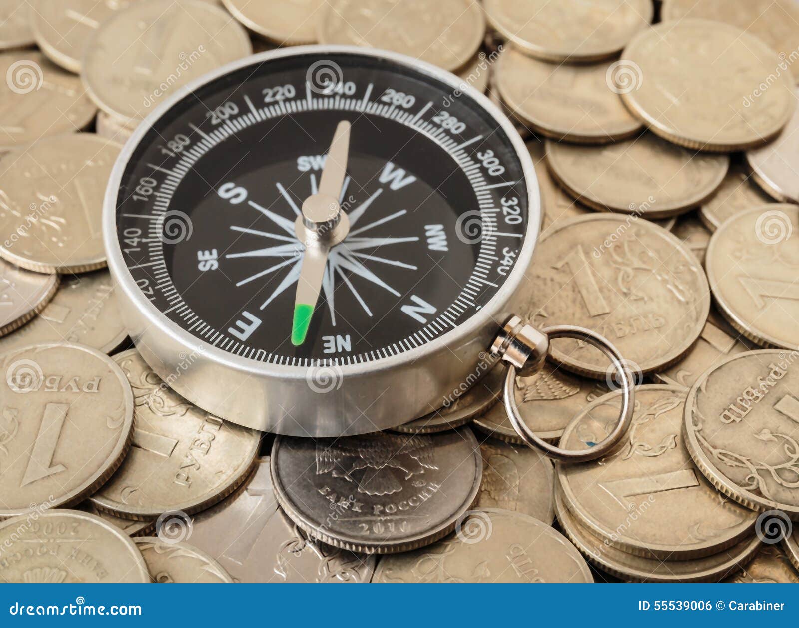 Compass on a coins stock photo. Image of cash, wealth - 55539006