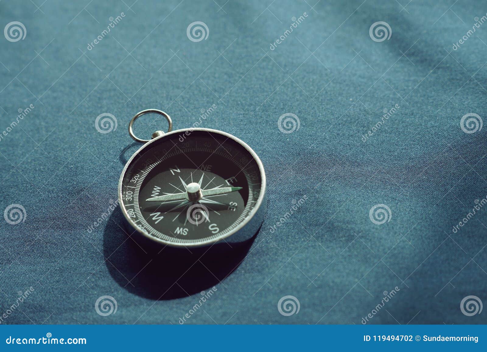 Compass on Blue Textile, Copy Space Stock Photo - Image of arrow ...