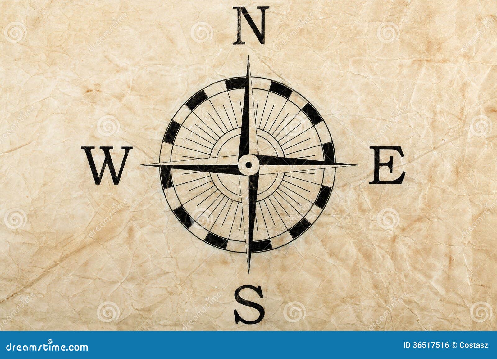 Compass on creased paper stock photo. Image of travel - 36517516