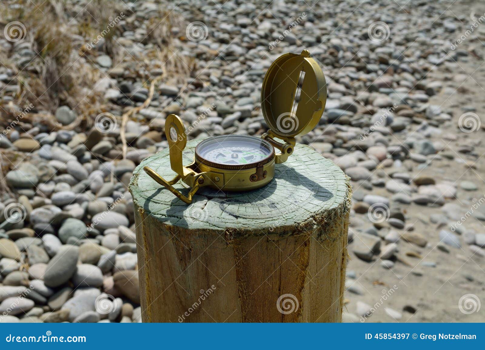 Compass at the Edge of the Beach Stock Image - Image of summer, ocean ...