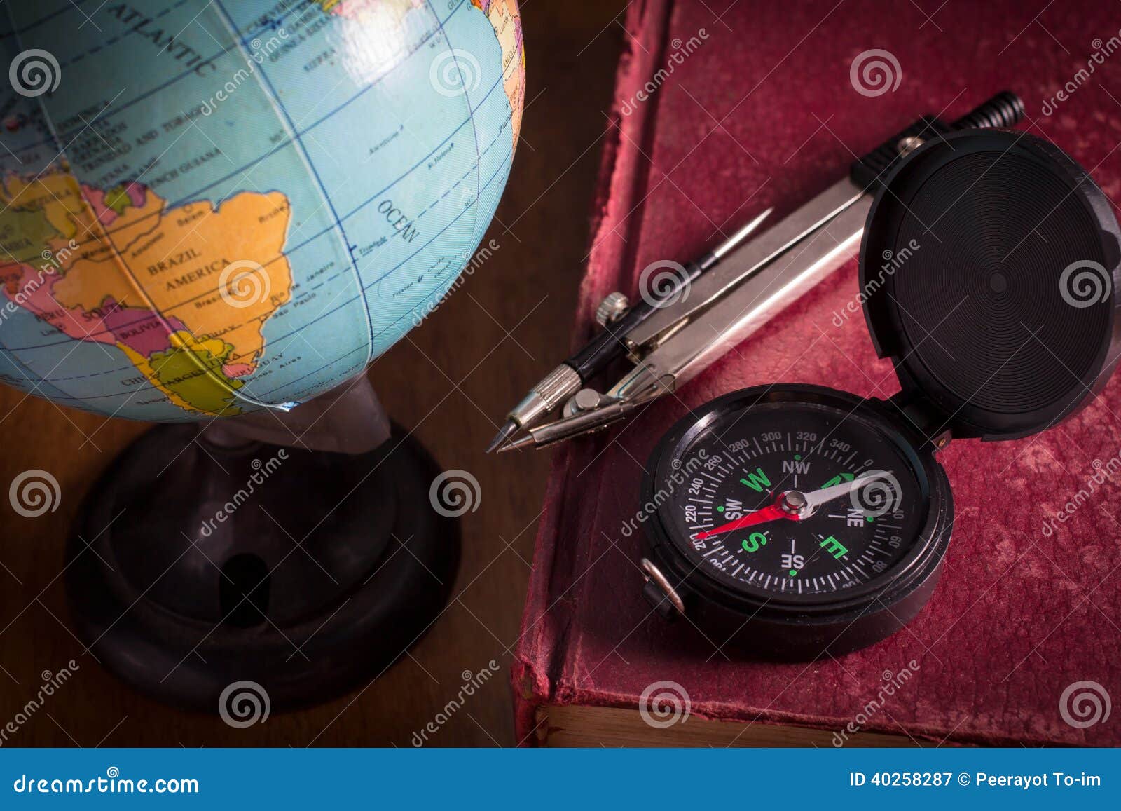 Compass with Globe on Antique Book. Stock Image - Image of geography ...