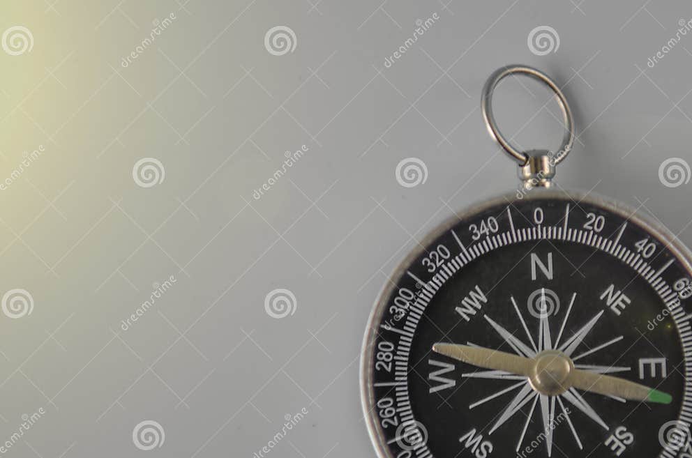 Compass on gray background stock photo. Image of orientation - 111922944