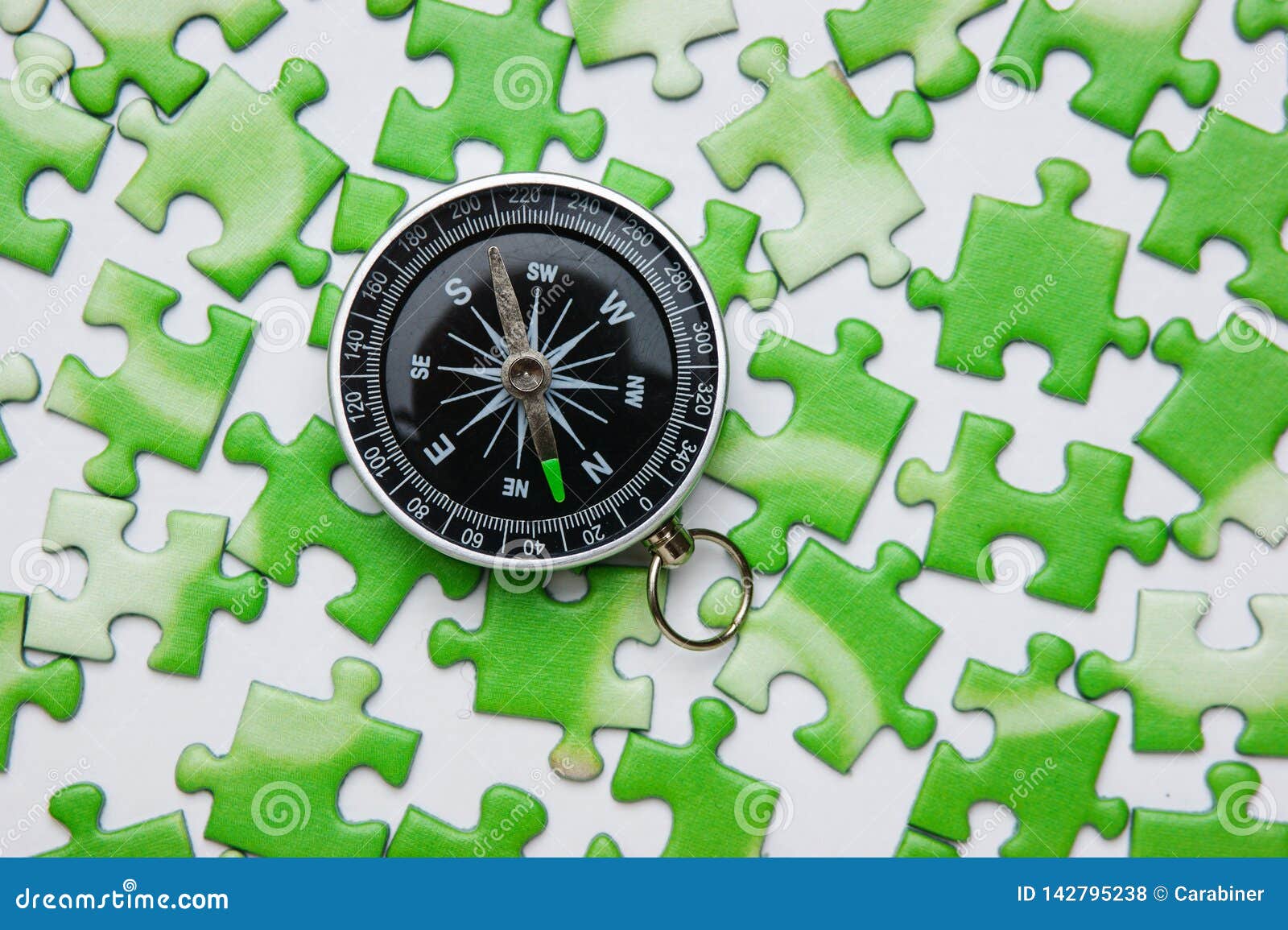 Compass on the Green Puzzle Stock Photo - Image of module, installation ...