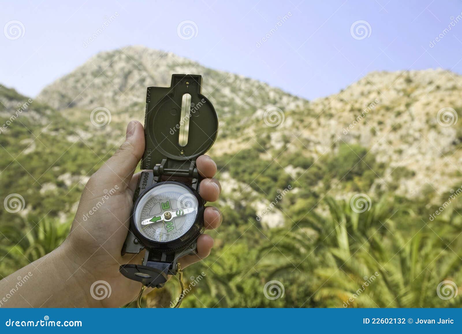 Compass in hand stock photo. Image of hand, terrain, direction - 22602132