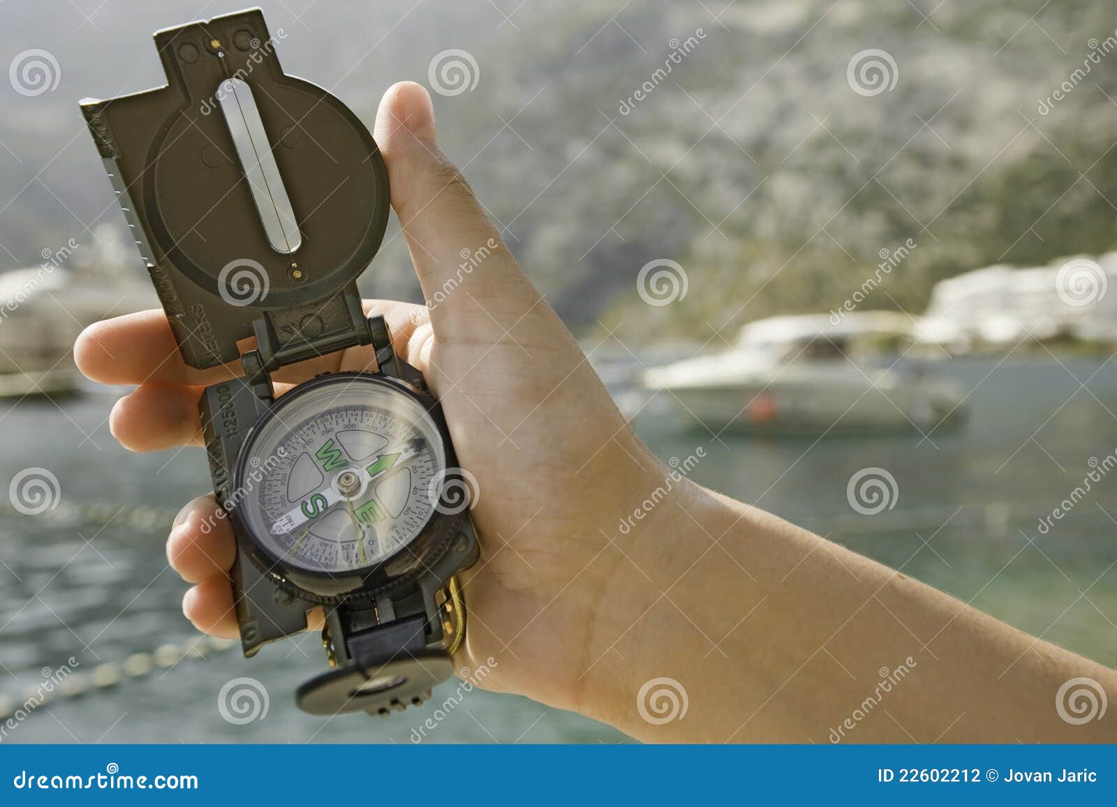 Compass in hand stock photo. Image of instrument, holding - 22602212