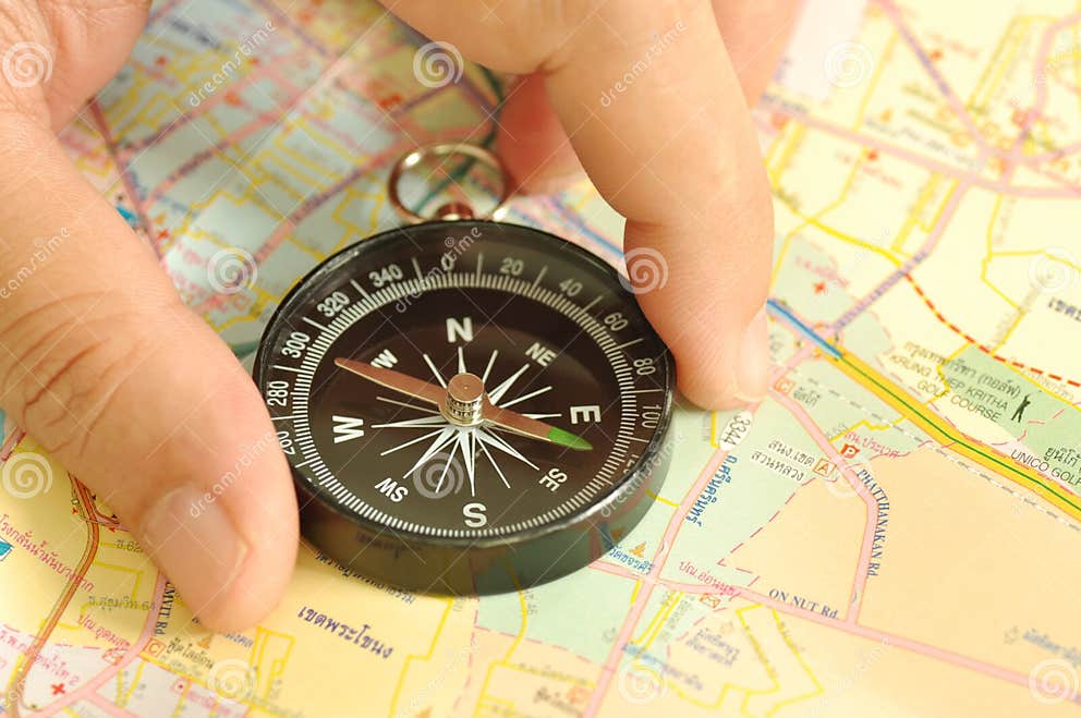 Compass in Hand Navigating on Map Pape Stock Image - Image of abstract ...