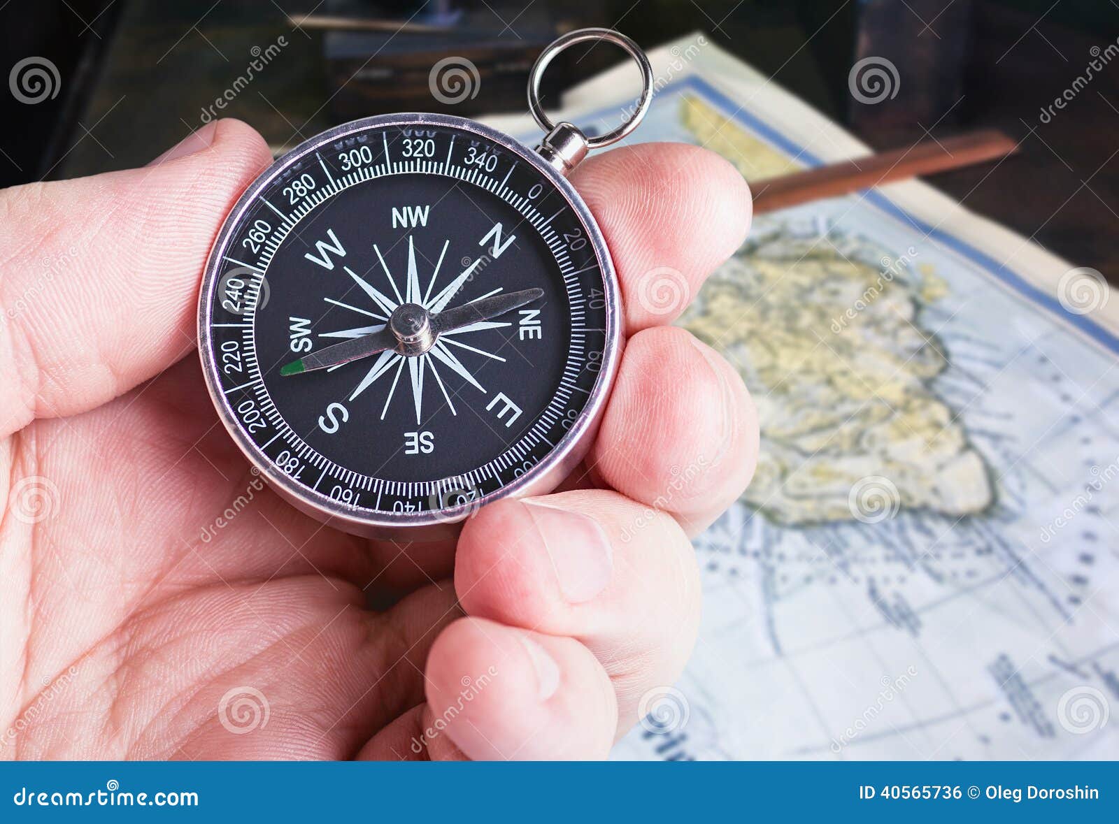 Compass in hand stock photo. Image of cartography, paper - 40565736