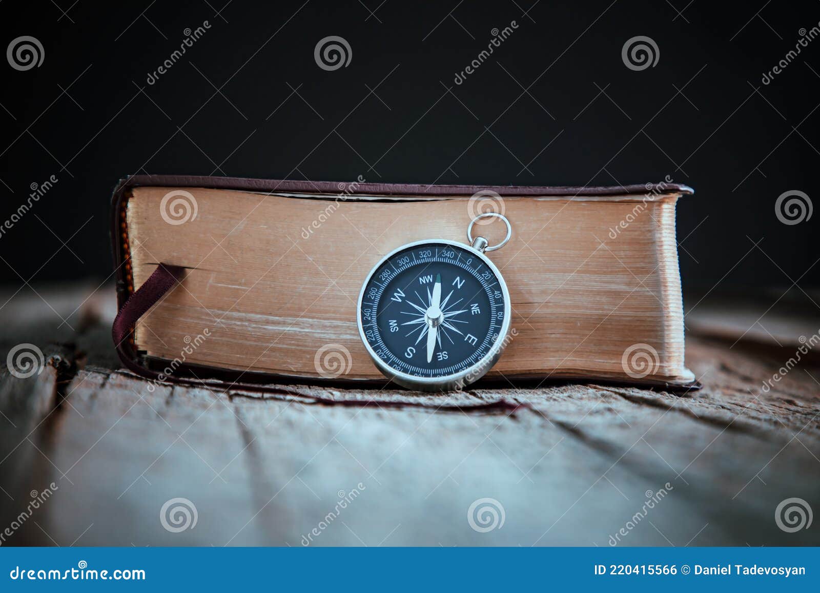 Compass with Holy Bible stock photo. Image of book, world - 220415566