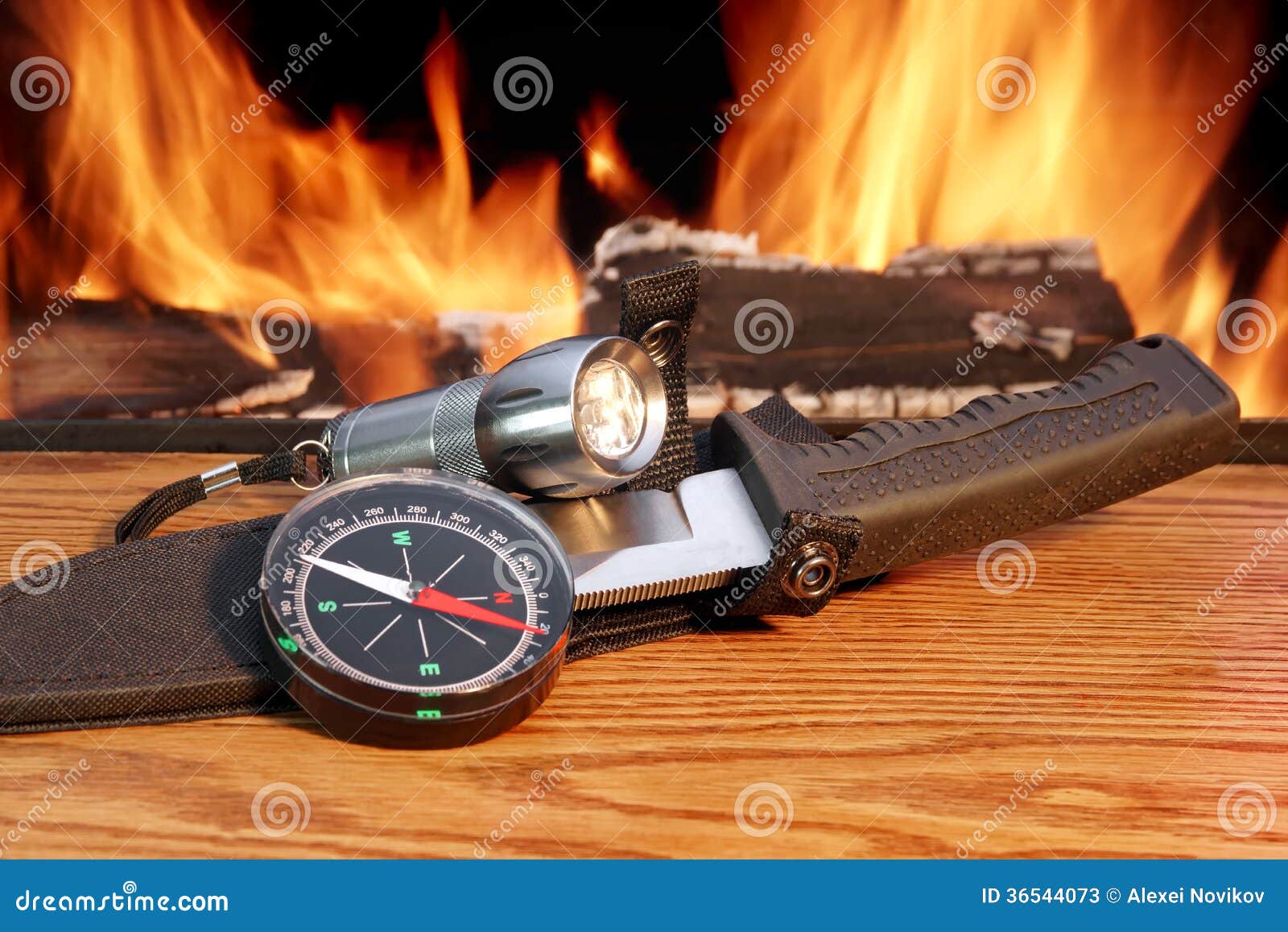 Compass, a Hunting Knife and a Handheld Flashlight Around the Ca Stock ...