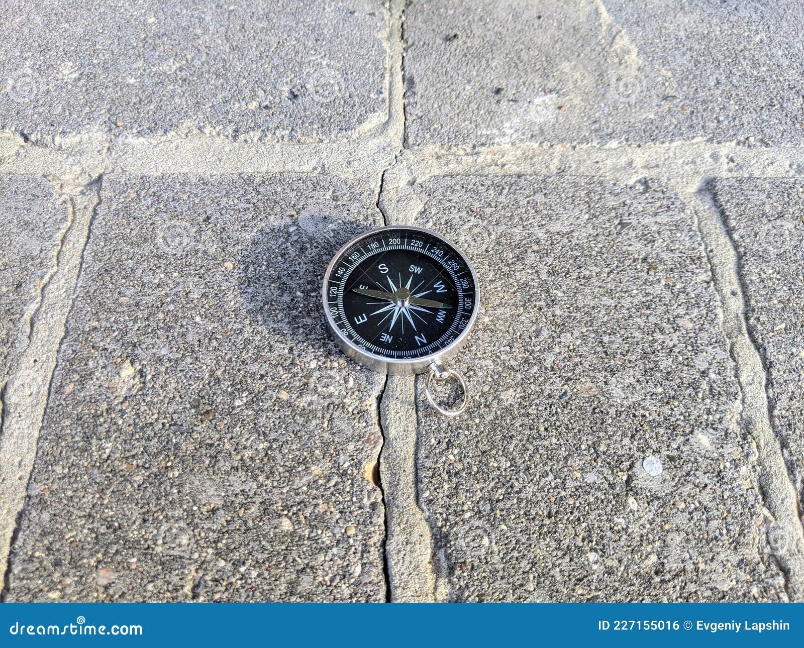 Compass Indicates Direction Lying on Gray Bricks Stock Photo - Image of ...