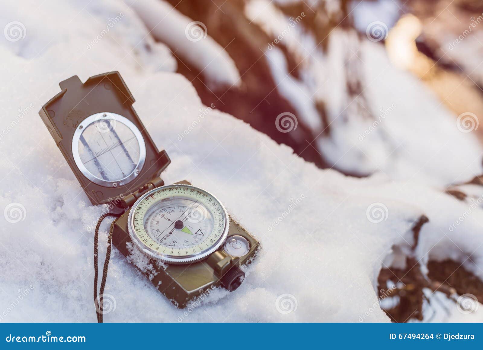 Compass instrument on snow stock photo. Image of journey - 67494264