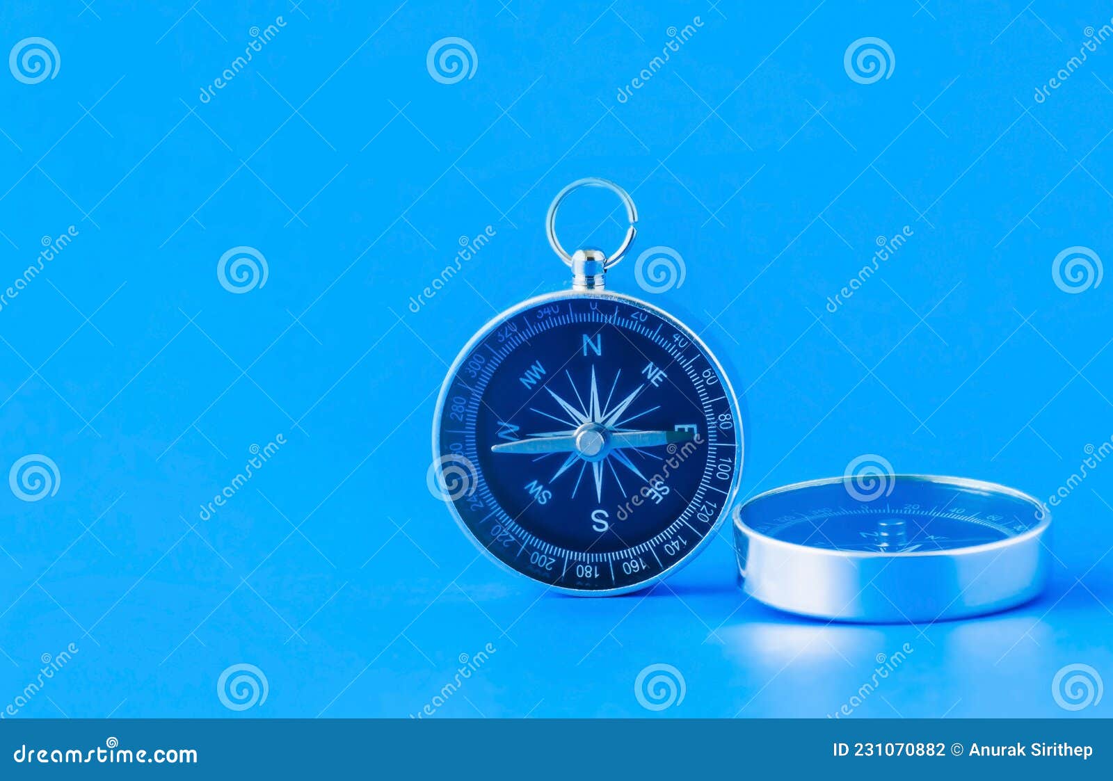 Compass Isolated on a Blue Background Stock Photo - Image of east ...